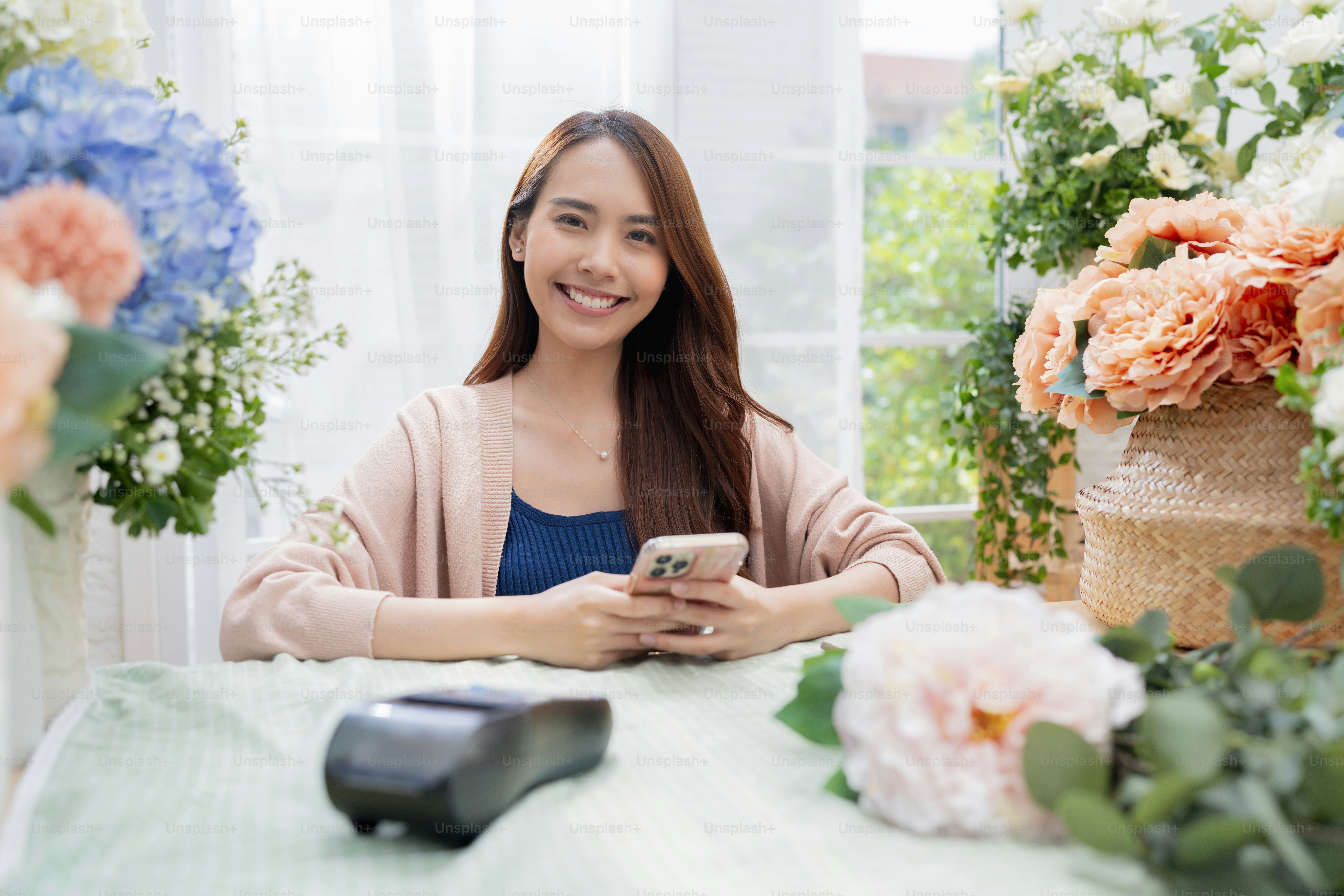 Portrait Asia Female florist smile arranging flowers in floral shop ...