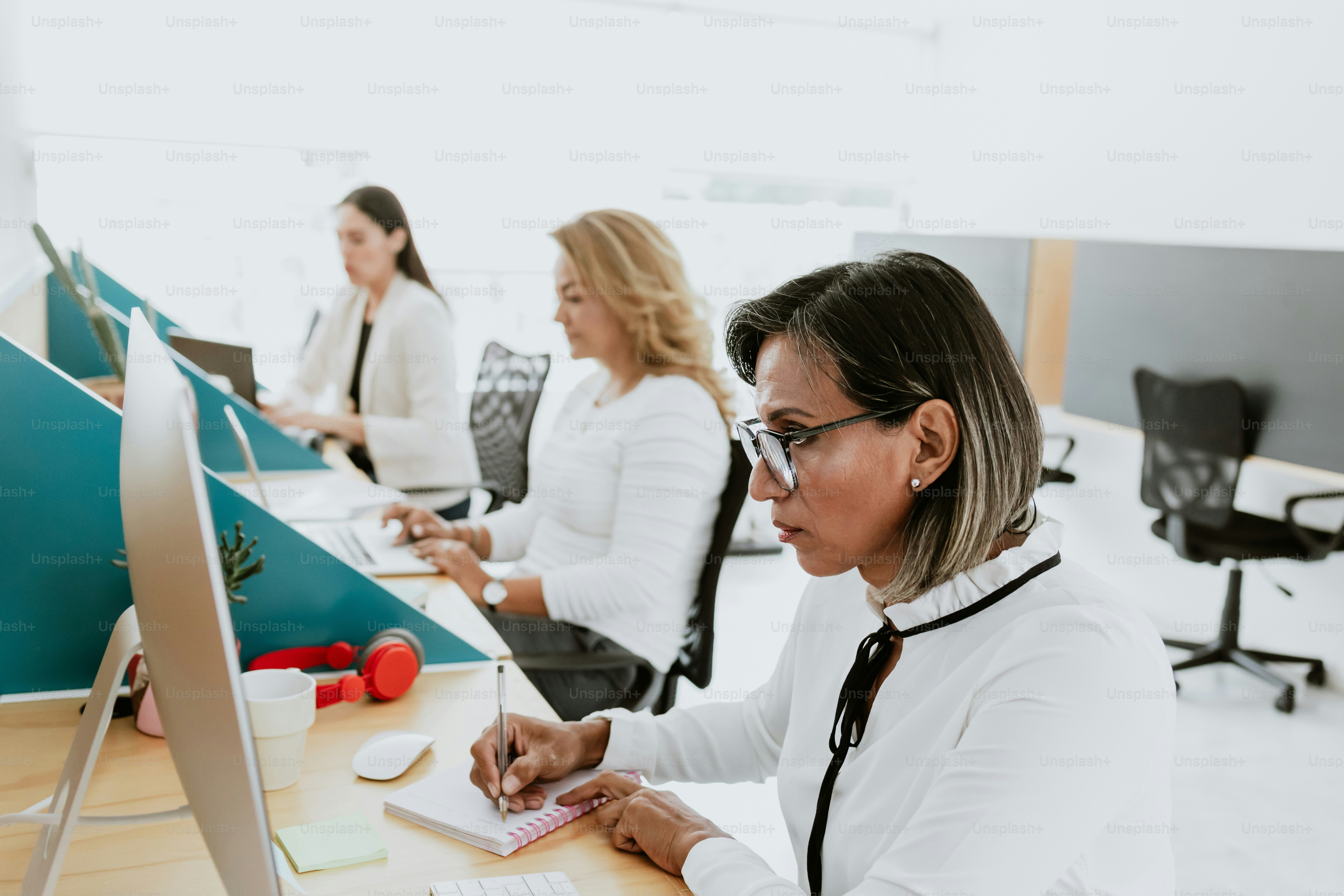 Transgender latin woman working with computer at the office in Mexico ...