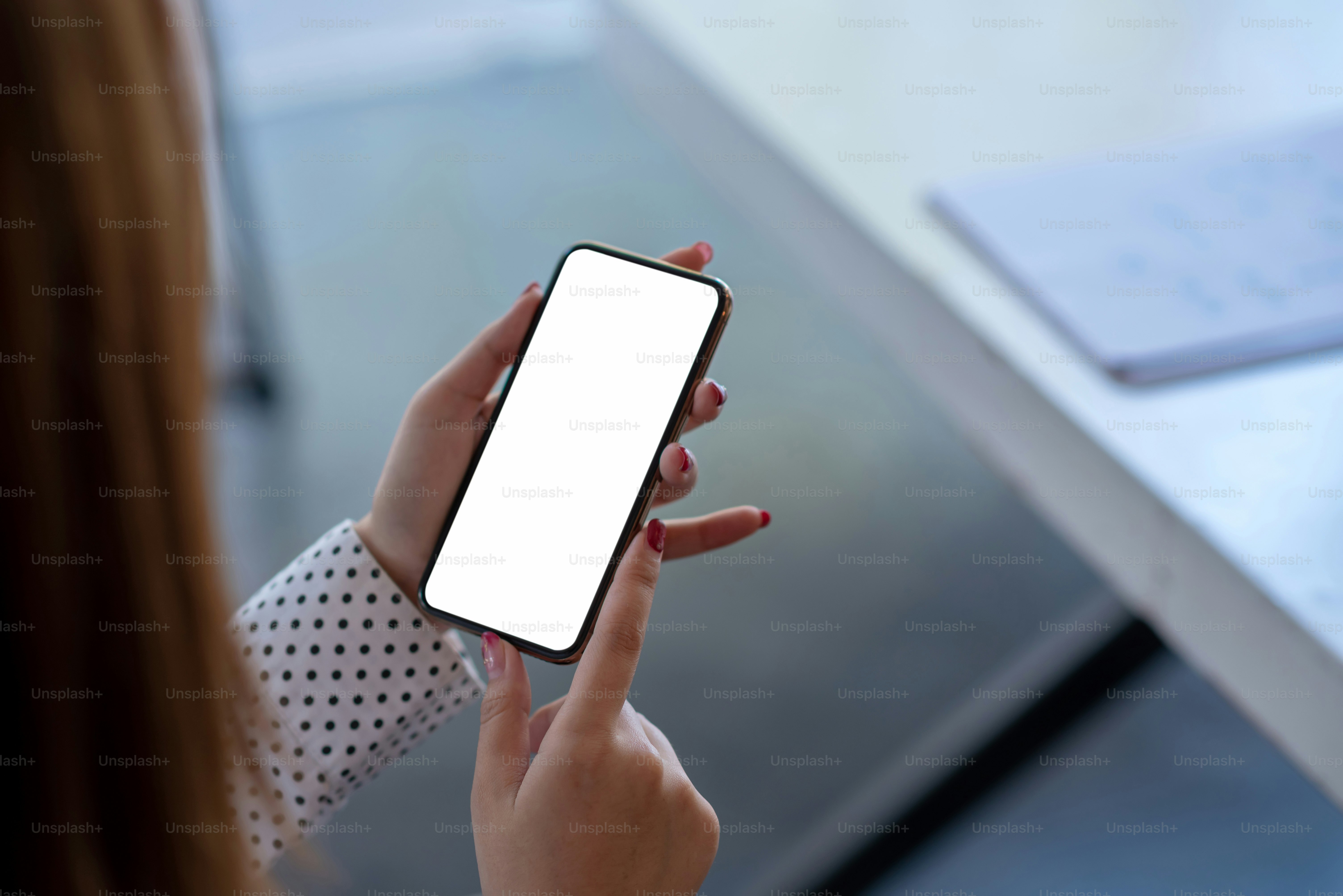 Mock up. image of woman holding mobile phone with blank white screen ...