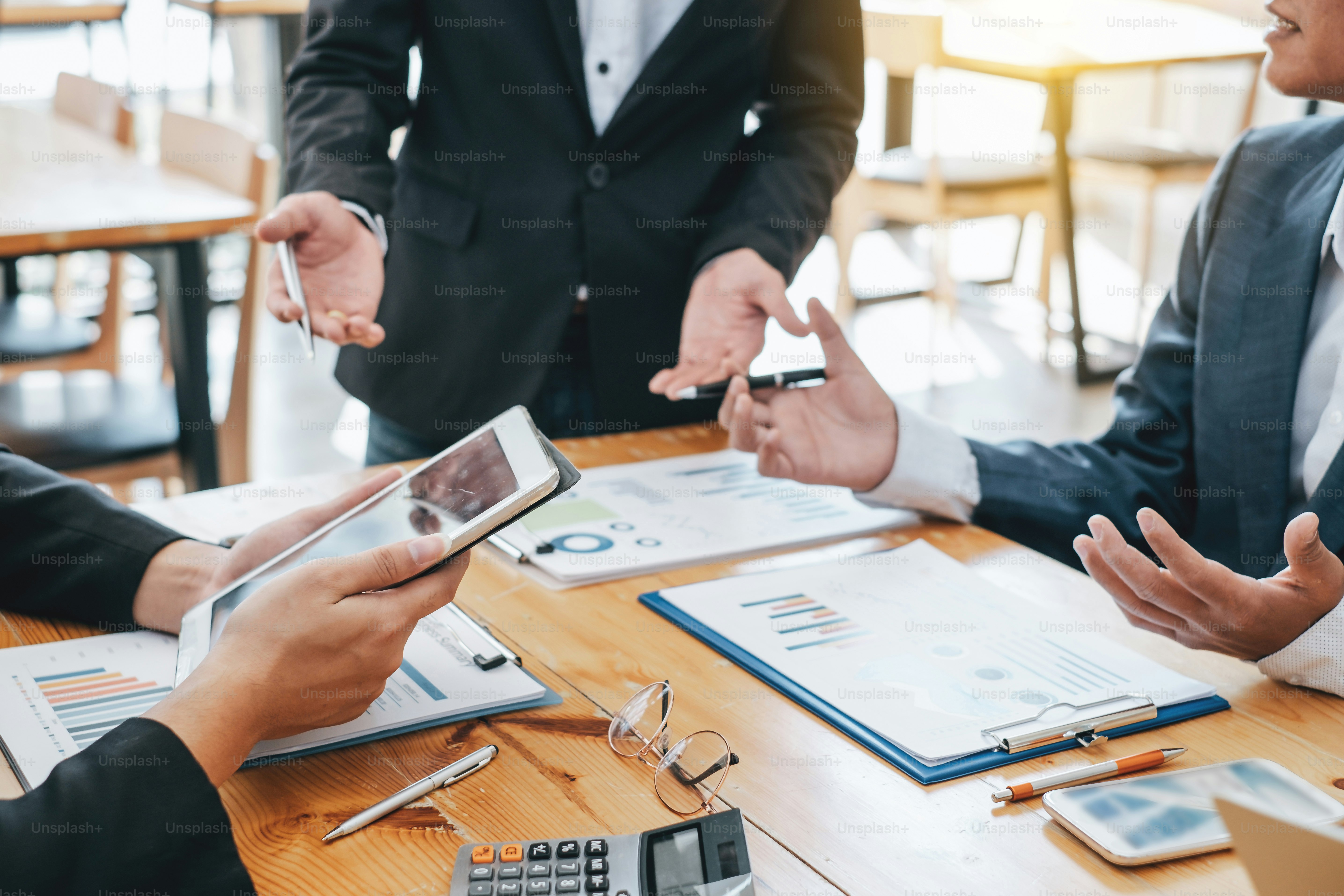 Businessmen view financial graph data to plan market investment. photo ...