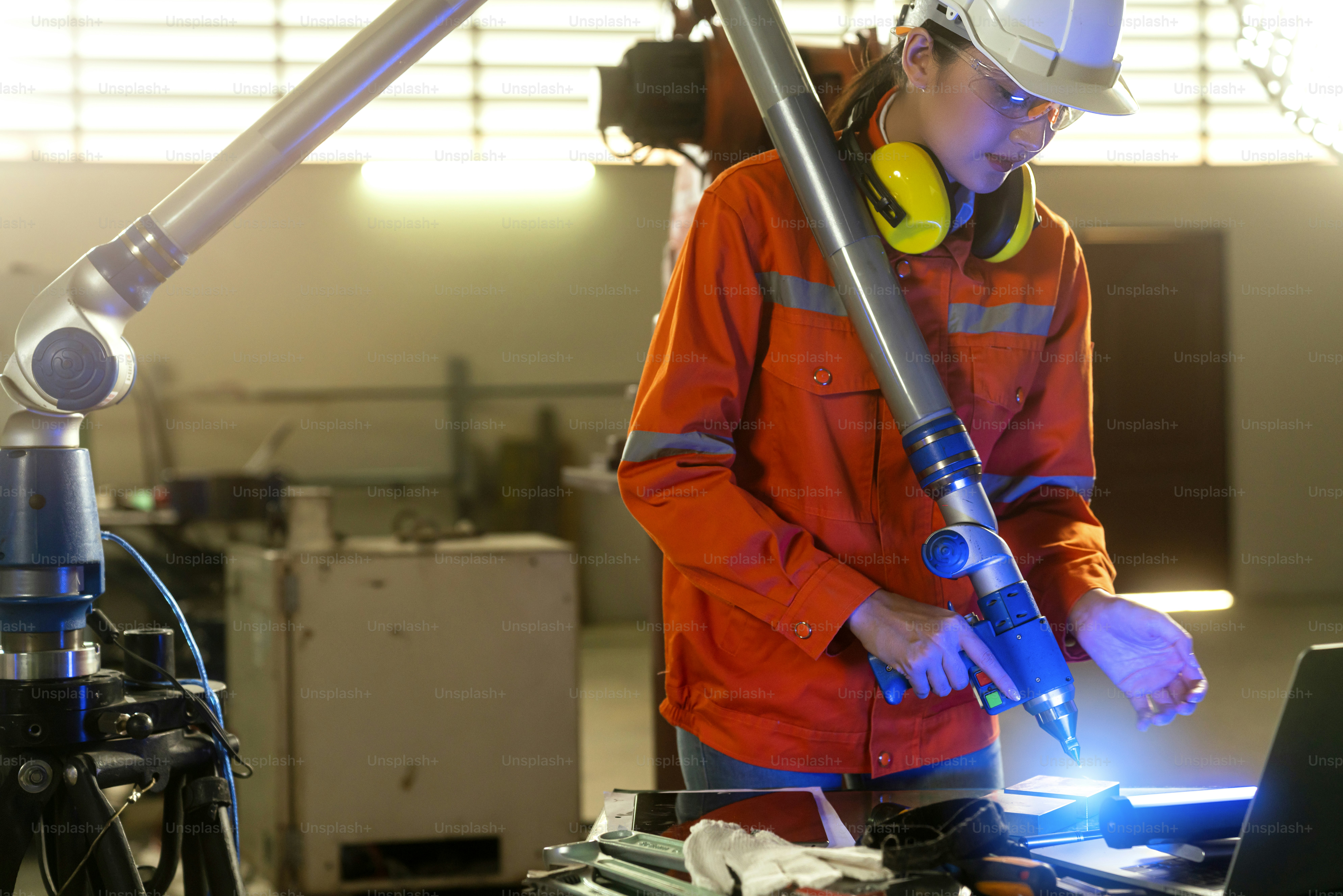 Asian female engineer specialist with Measuring machine with a ...