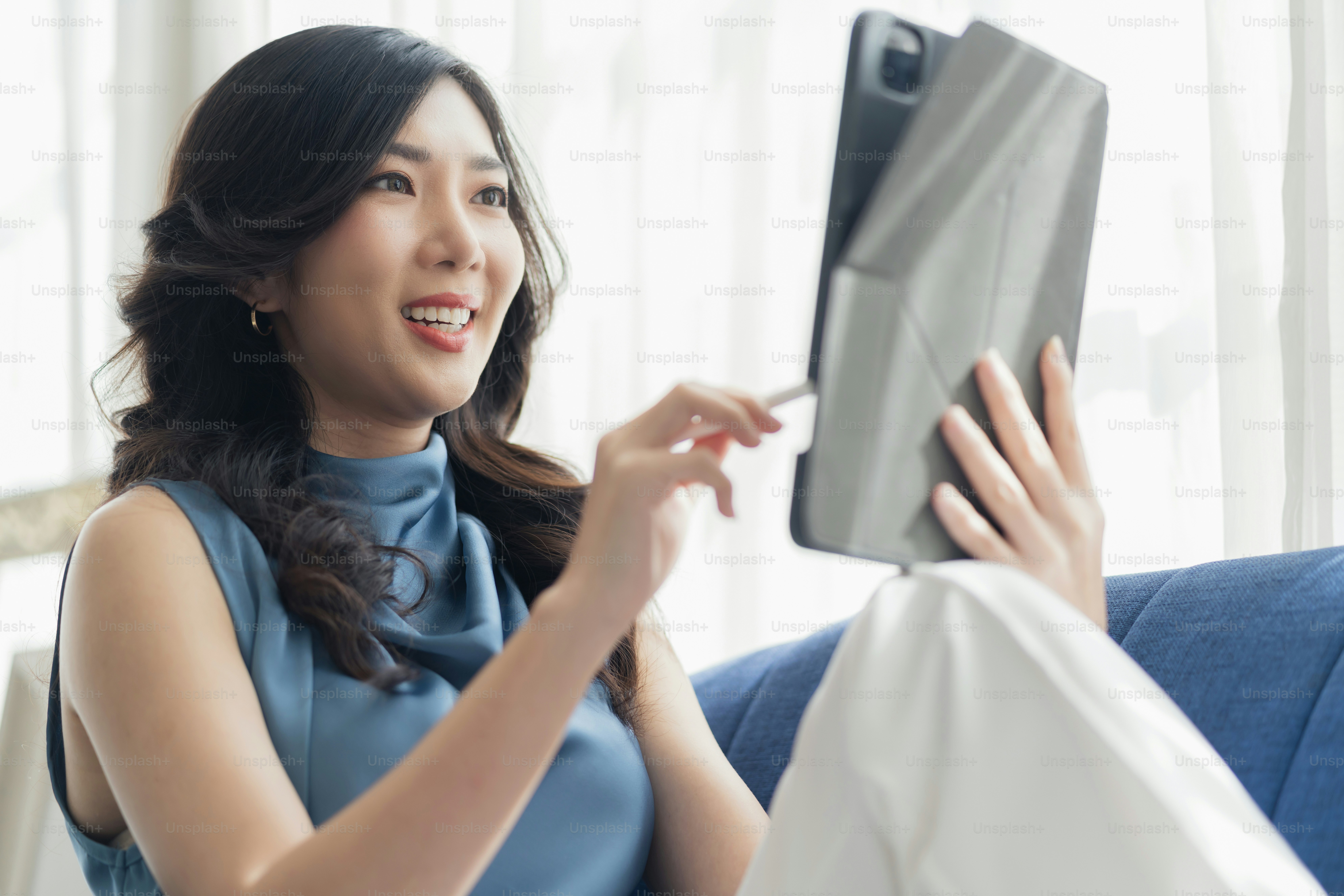 Casual working at home relax casual using tablet device in living room ...