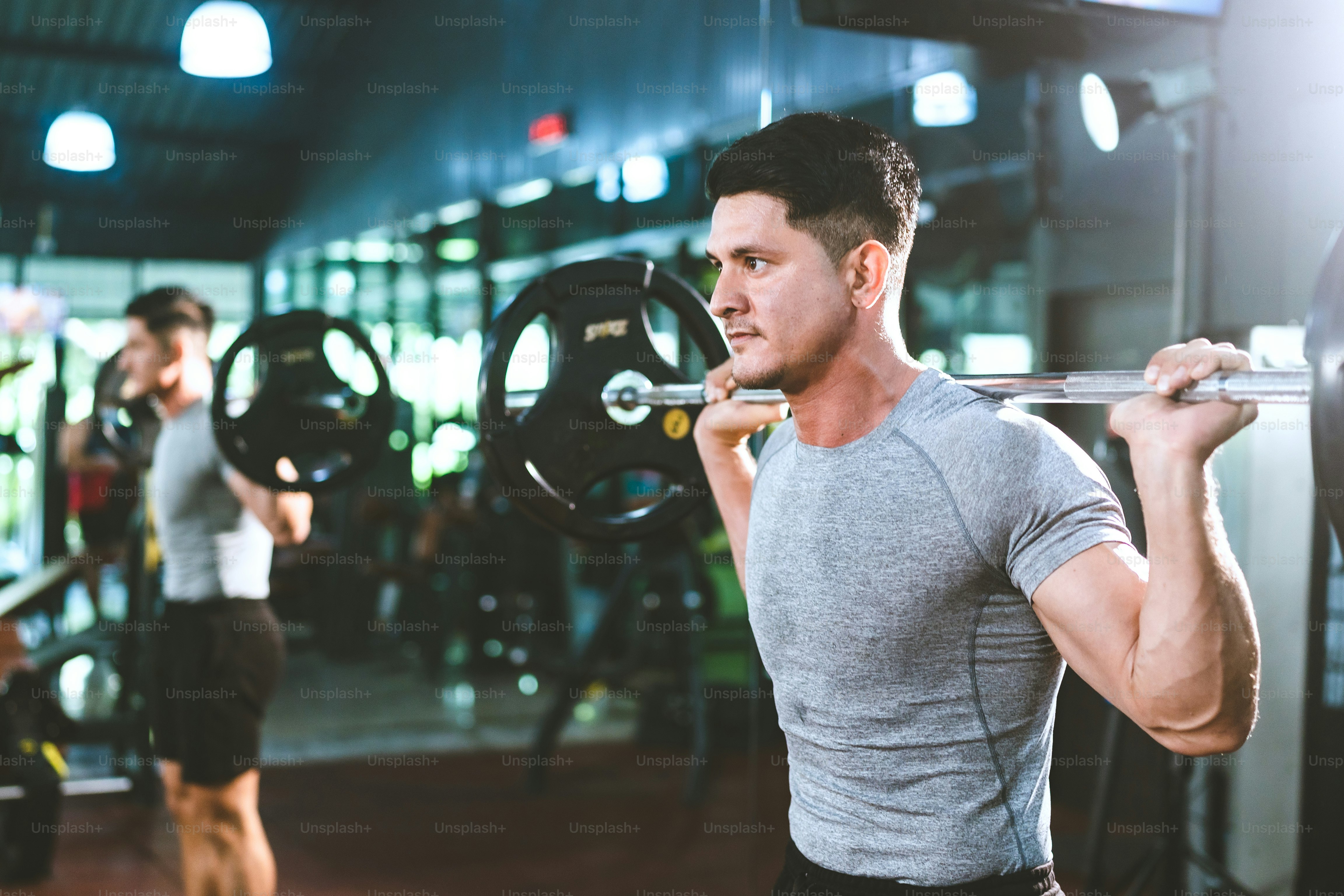 Strong athlete man person exercising in the sport gym, workout exercise ...