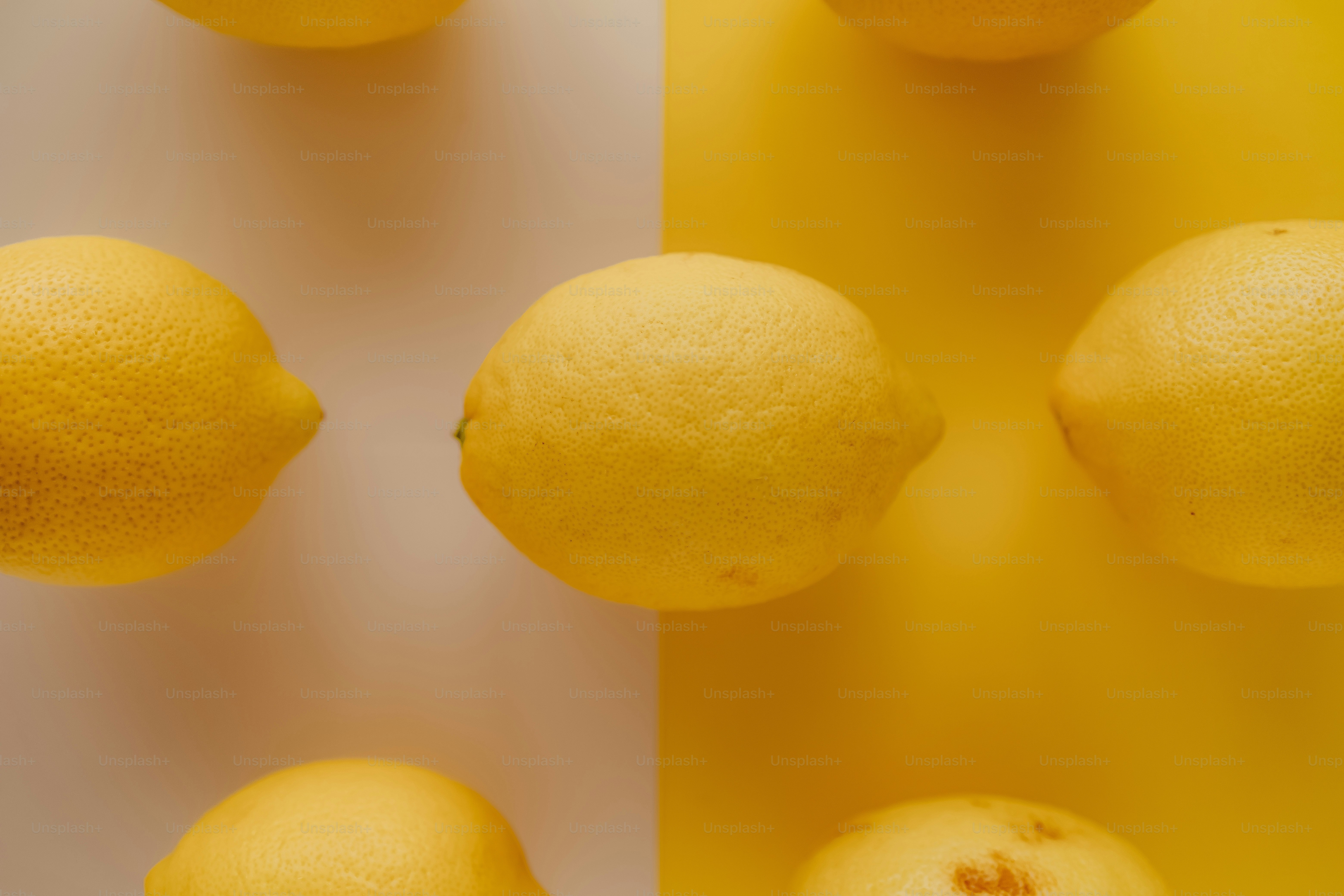 A group of lemons sitting next to each other photo – Fruit Image on ...