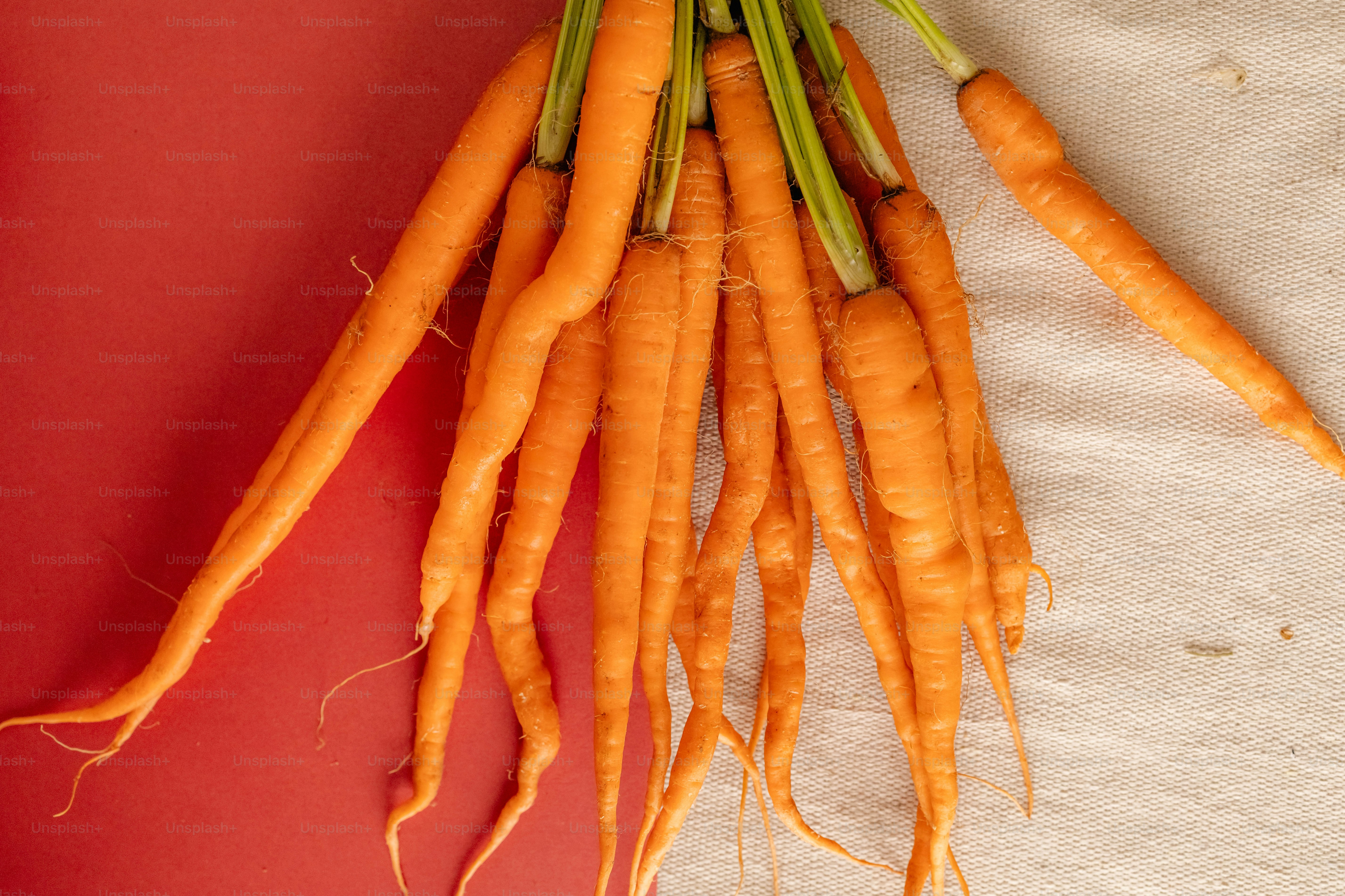 A bunch of carrots sitting on top of a table photo – Vitamin a Image on ...