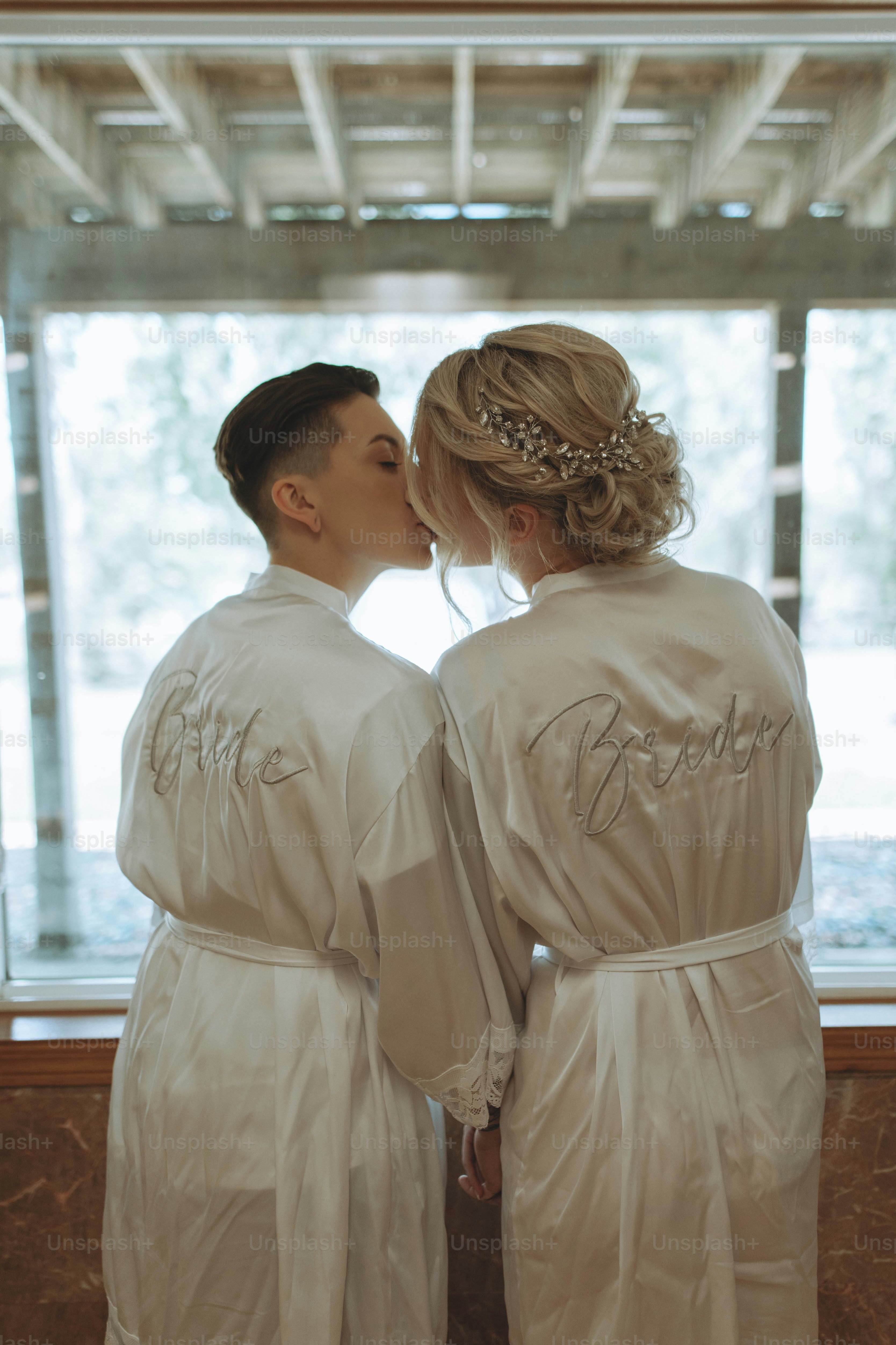 A couple of women standing next to each other photo – Lgbt2+ Image on ...