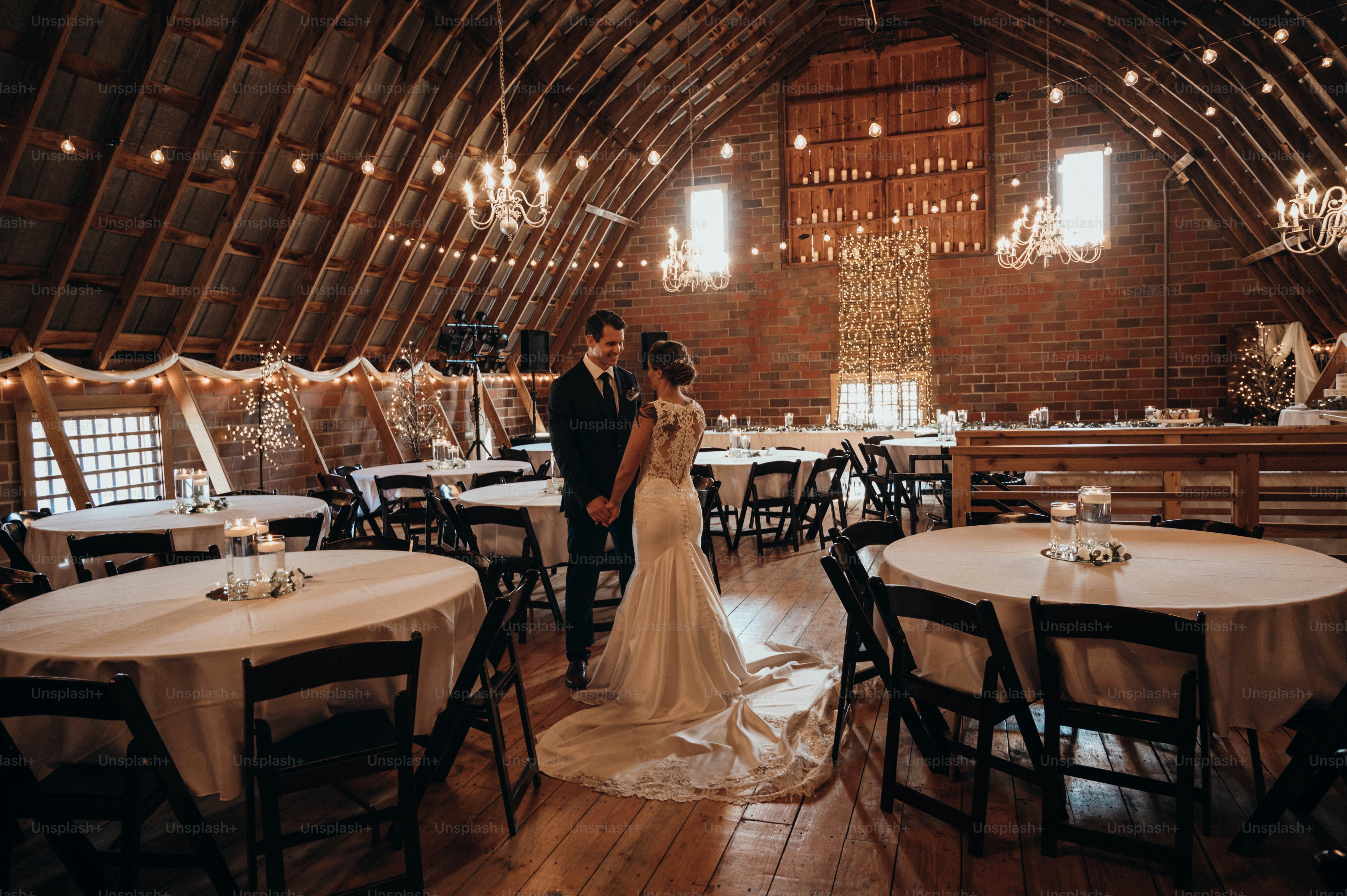 A bride and groom standing in a barn photo – Wedding Image on Unsplash