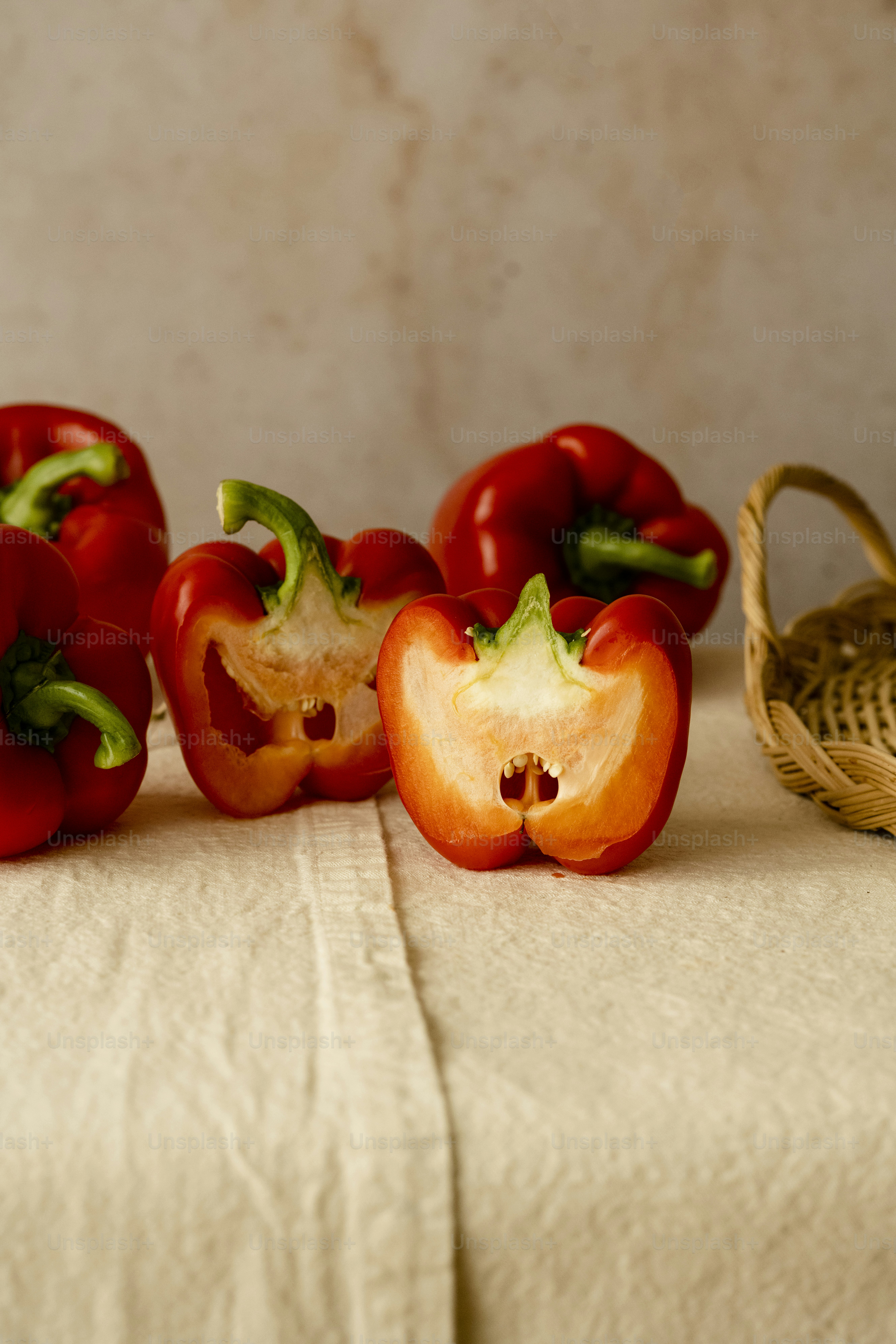 A group of red peppers sitting on top of a table photo – Capsicum Image ...