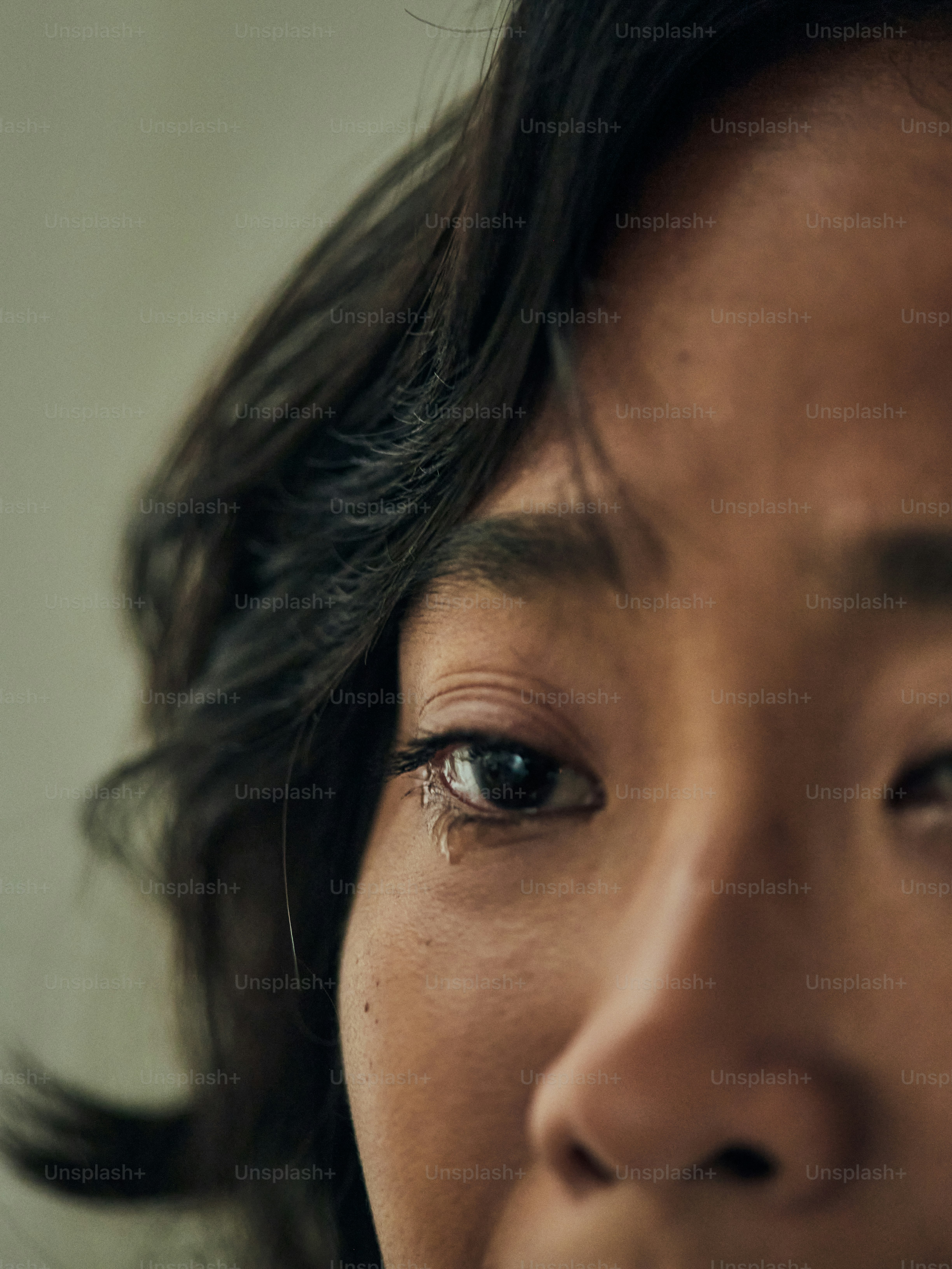 A close up of a woman's face with a concerned look on her face photo ...