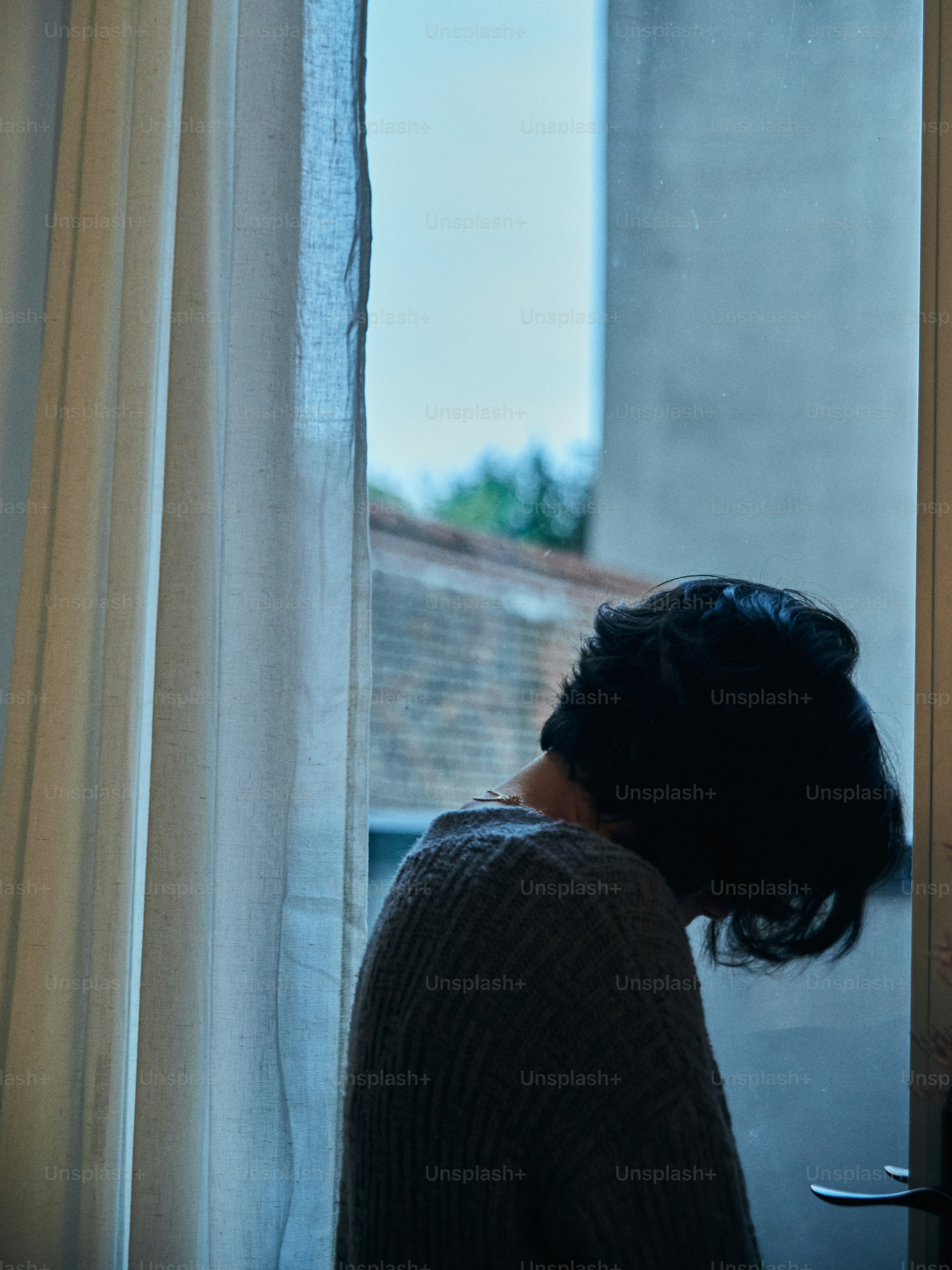 Sad Woman Looking Out Window