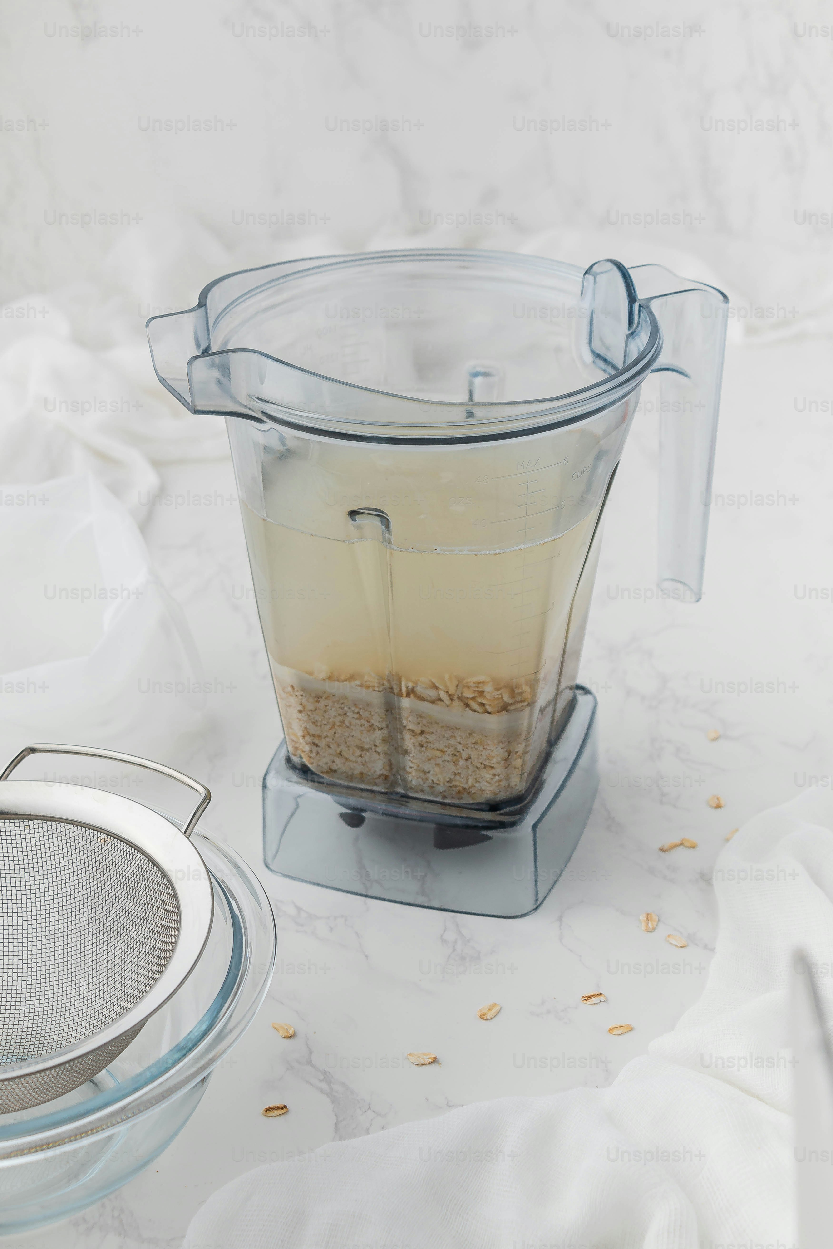 A blender with a mixture in it next to a strainer photo – Vegetarian ...