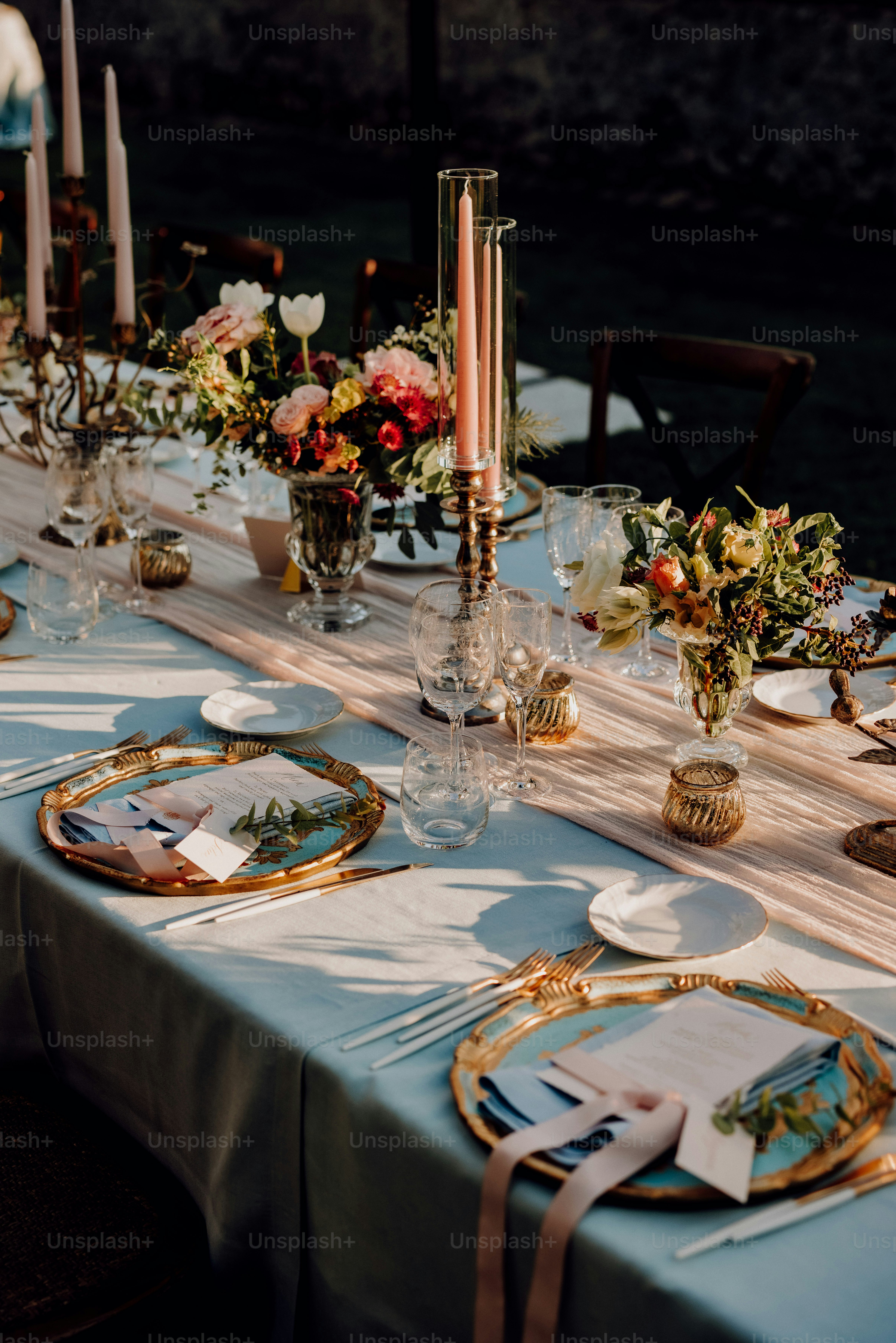 A long table with plates and place settings photo – Event management ...