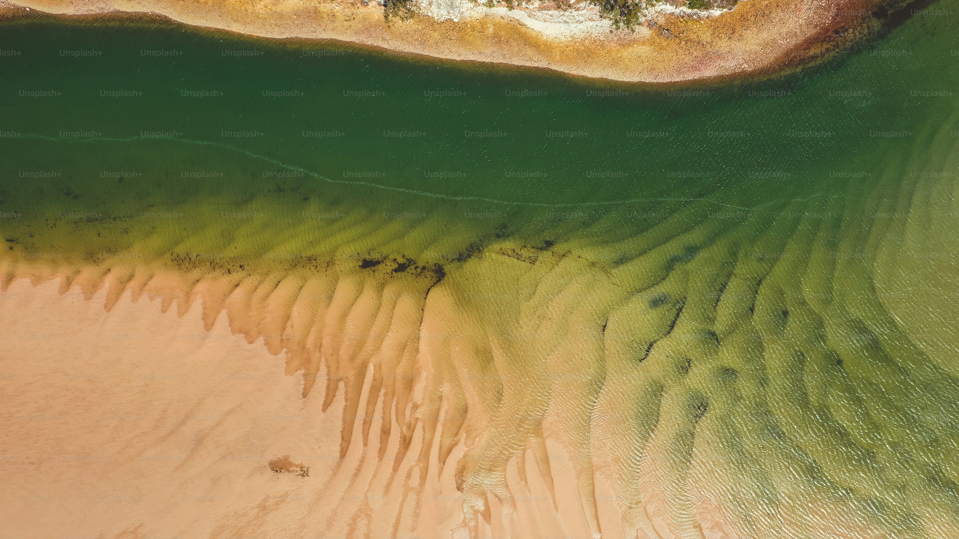 An aerial view of a body of water photo – Sand Image on Unsplash