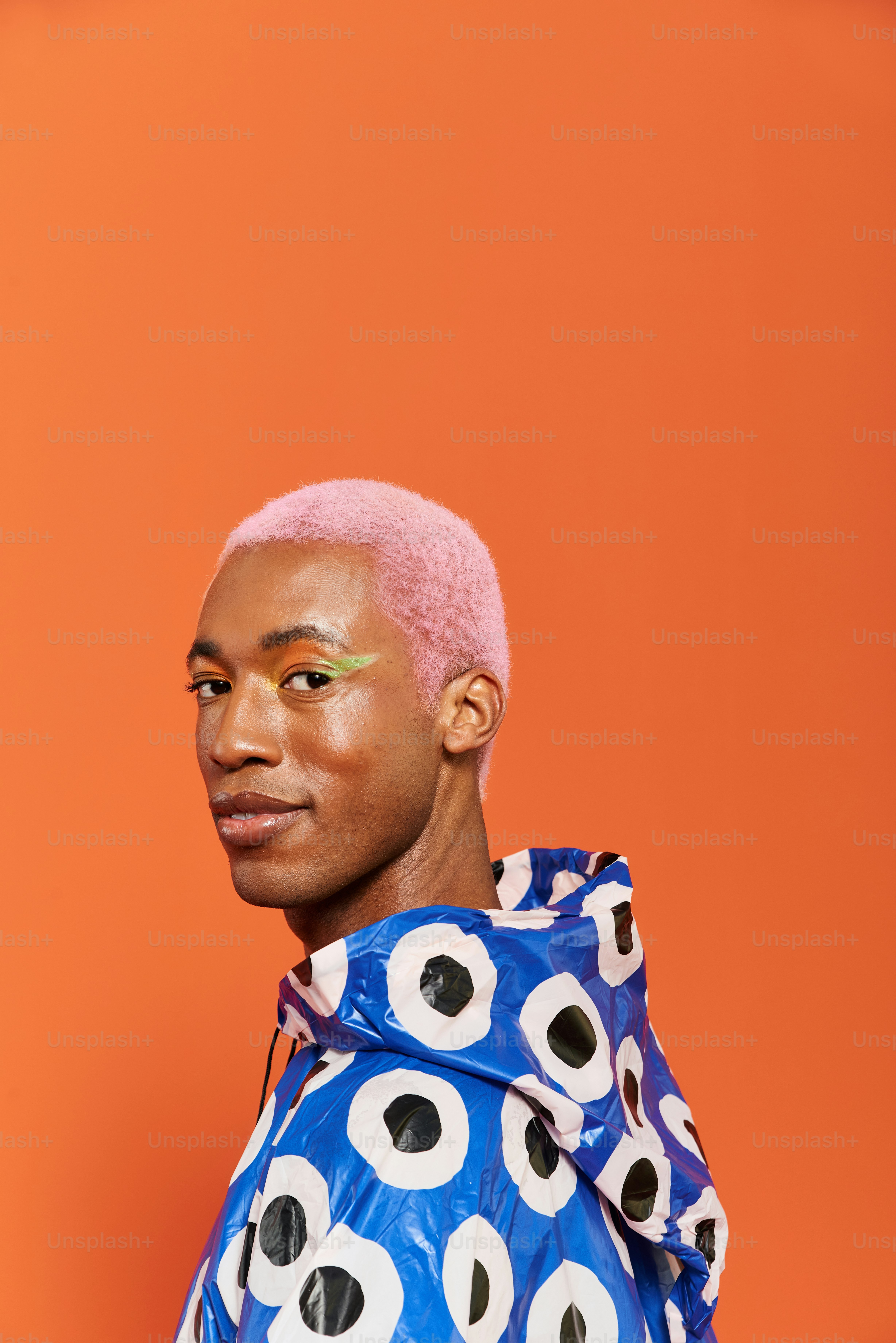 A man with a pink wig holding a magnifying glass photo – Looking Image ...