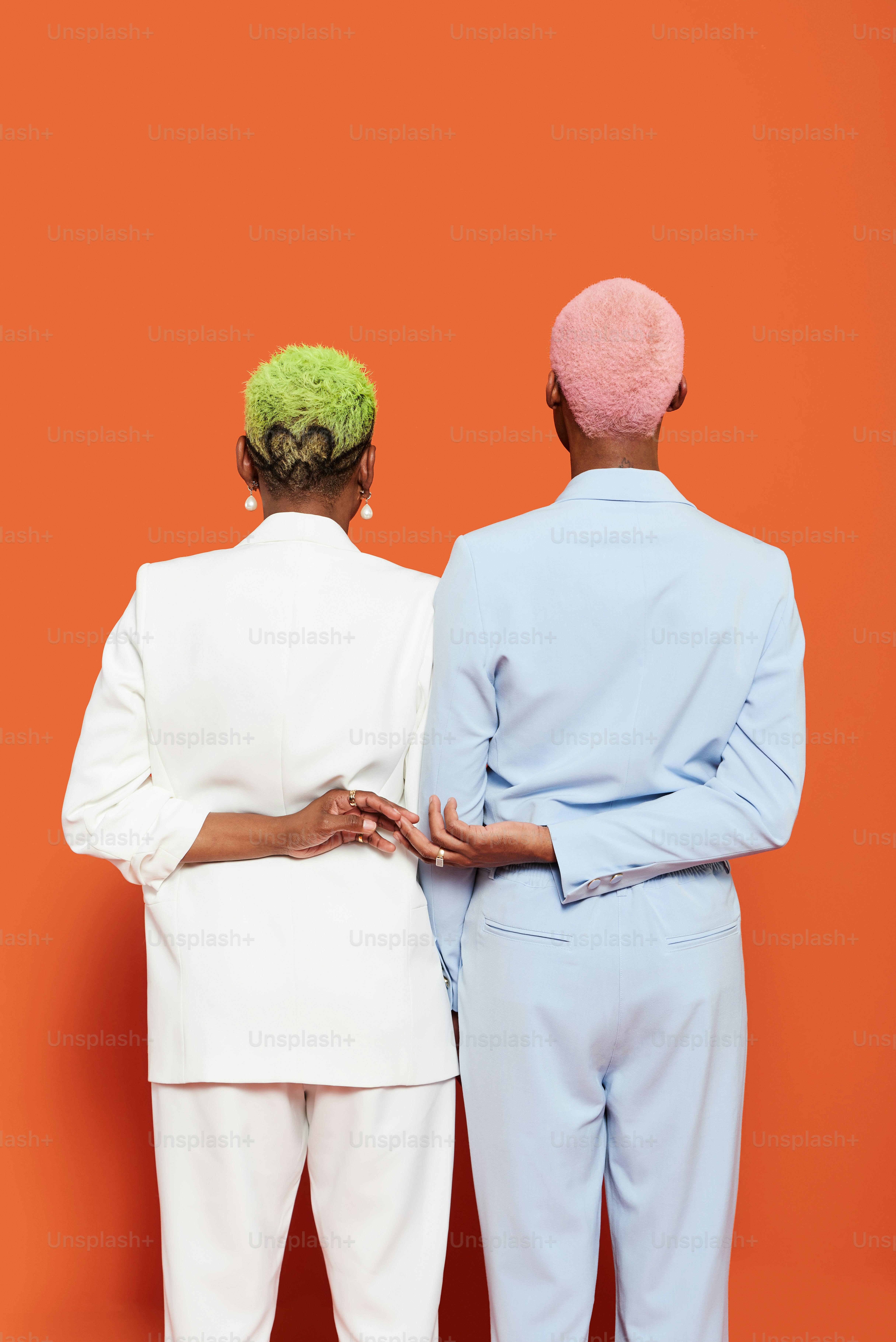 A couple of women standing next to each other photo – Backside Image on ...