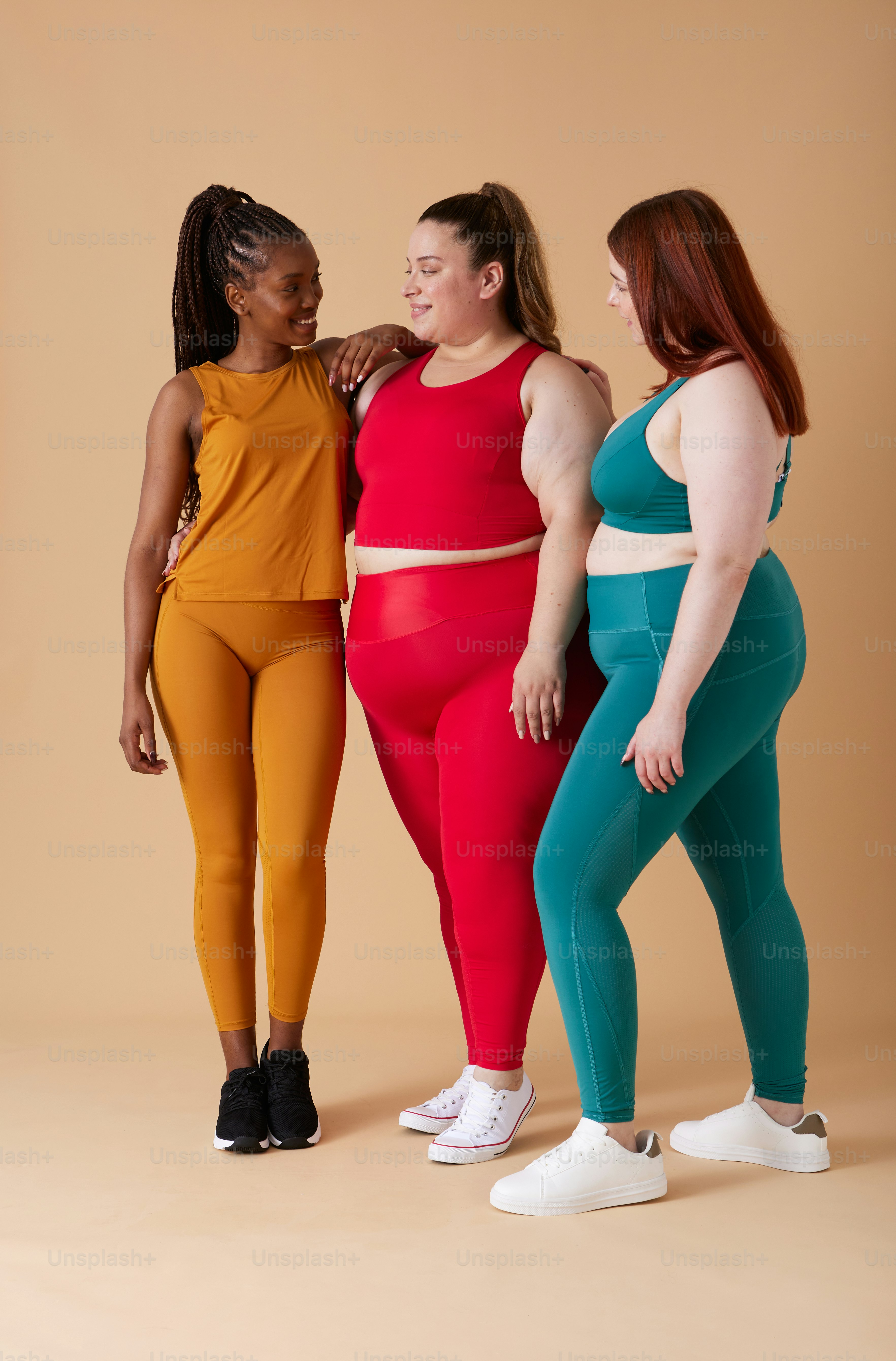 A group of three women standing next to each other photo – Portrait ...