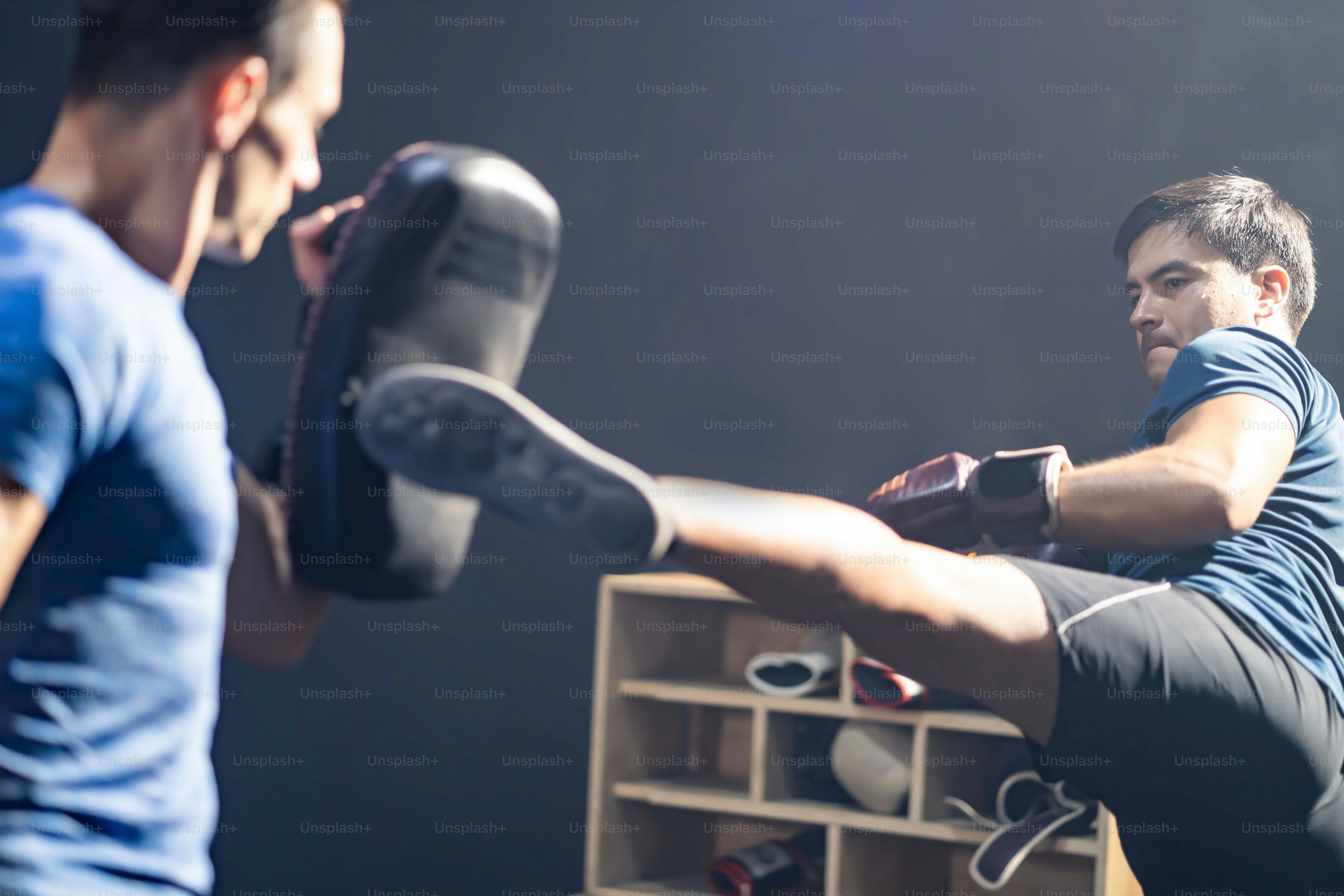 Caucasian Fitness instructor teach and motivate young sportsman boxer ...