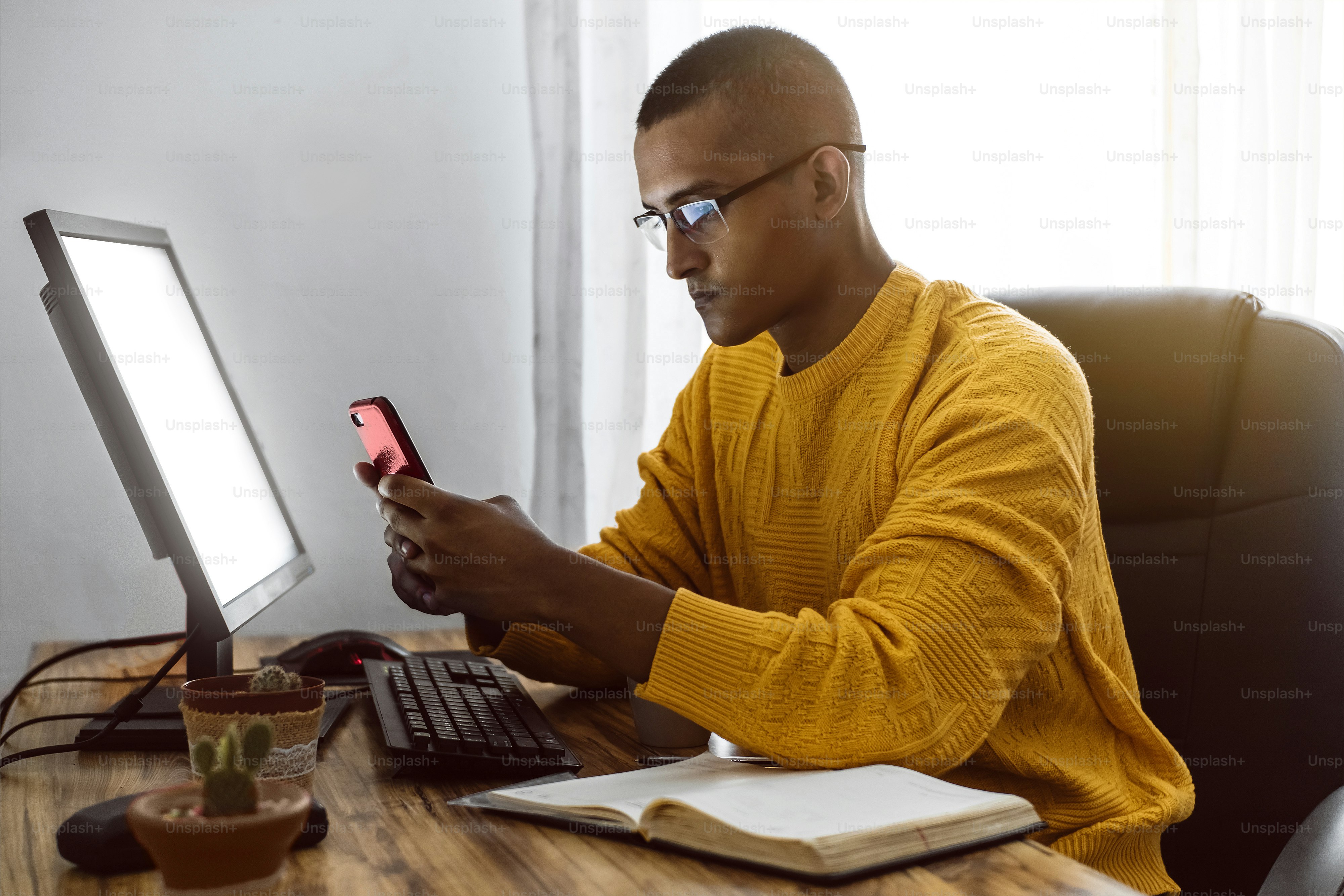 Portrait of a Latin American or Hispanic young adult checking his phone ...