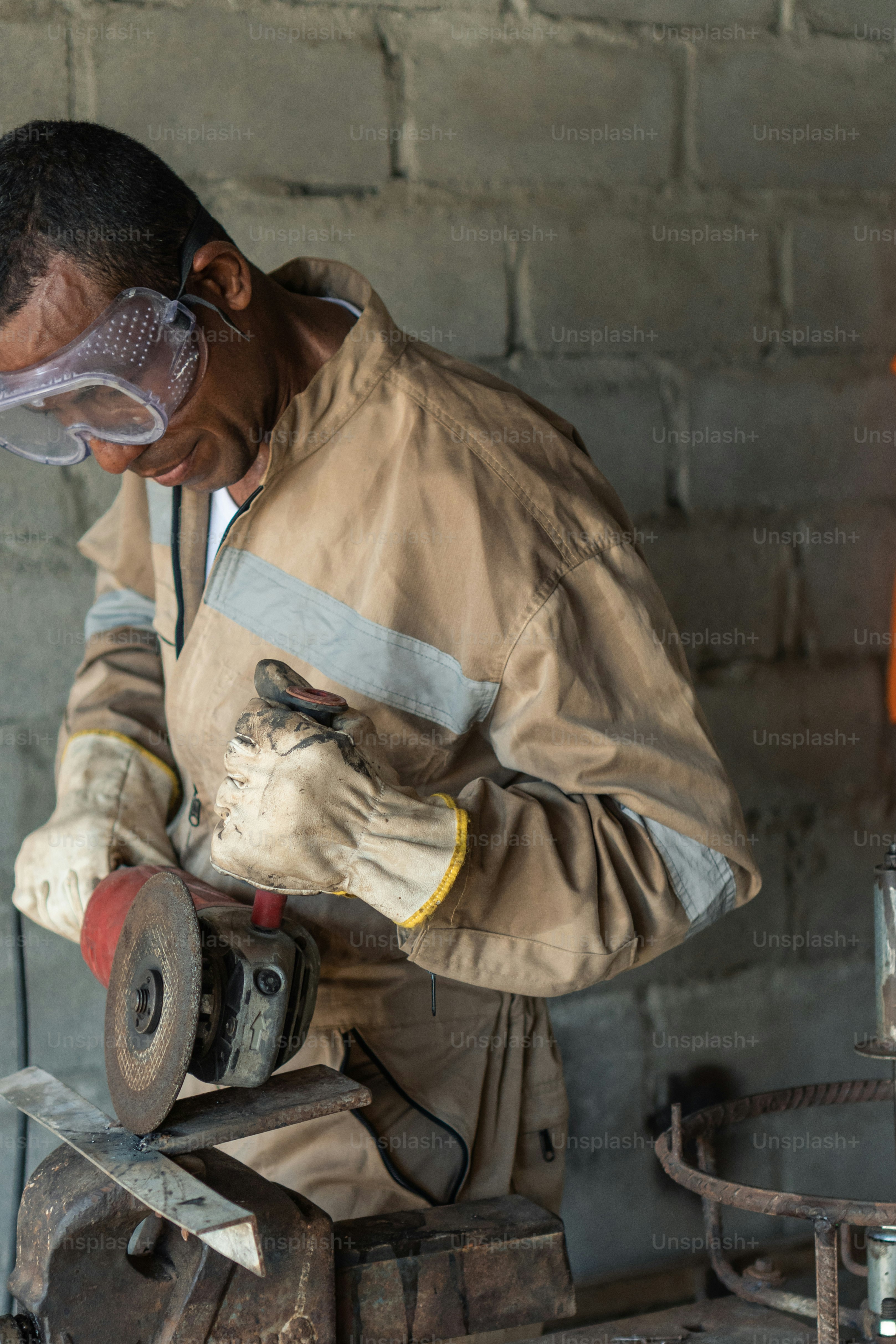 A welder during a day's work in the metallurgical factory. photo ...