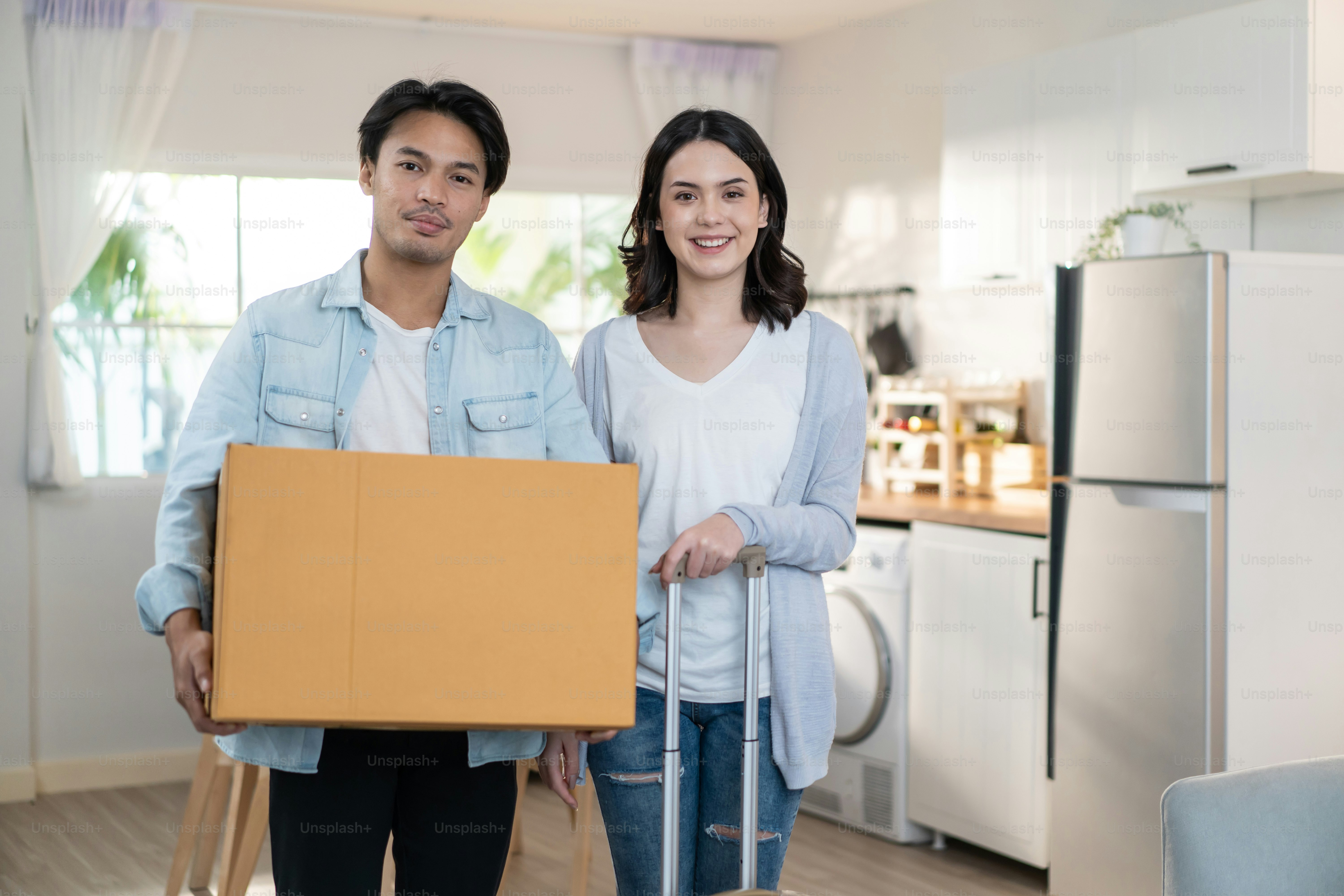 Portrait of Asian young new marriage couple move to new house together ...