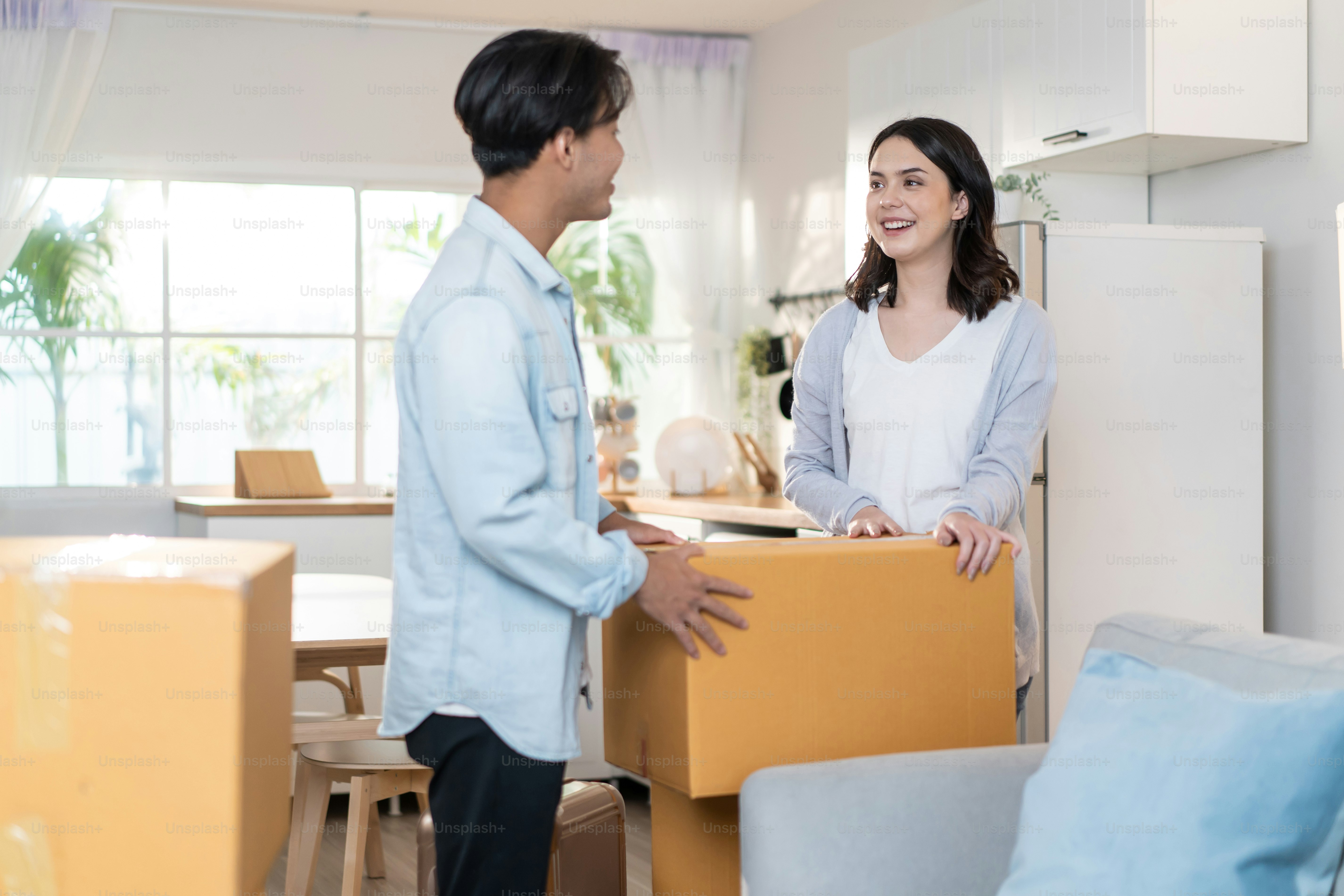 Asian young happy new marriage couple moving to new house together ...