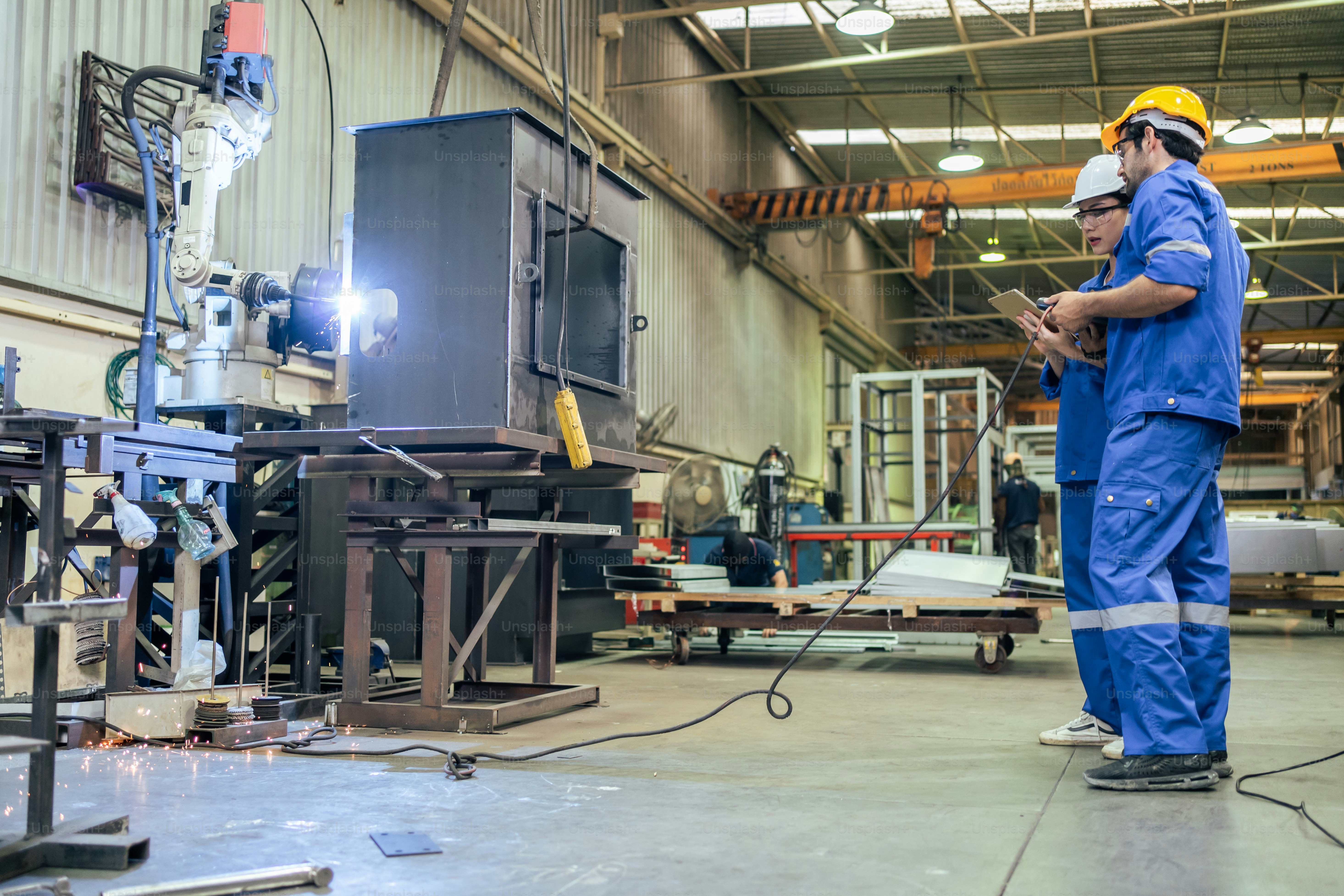 Asian attractive man industrial worker working in manufacturing plant ...