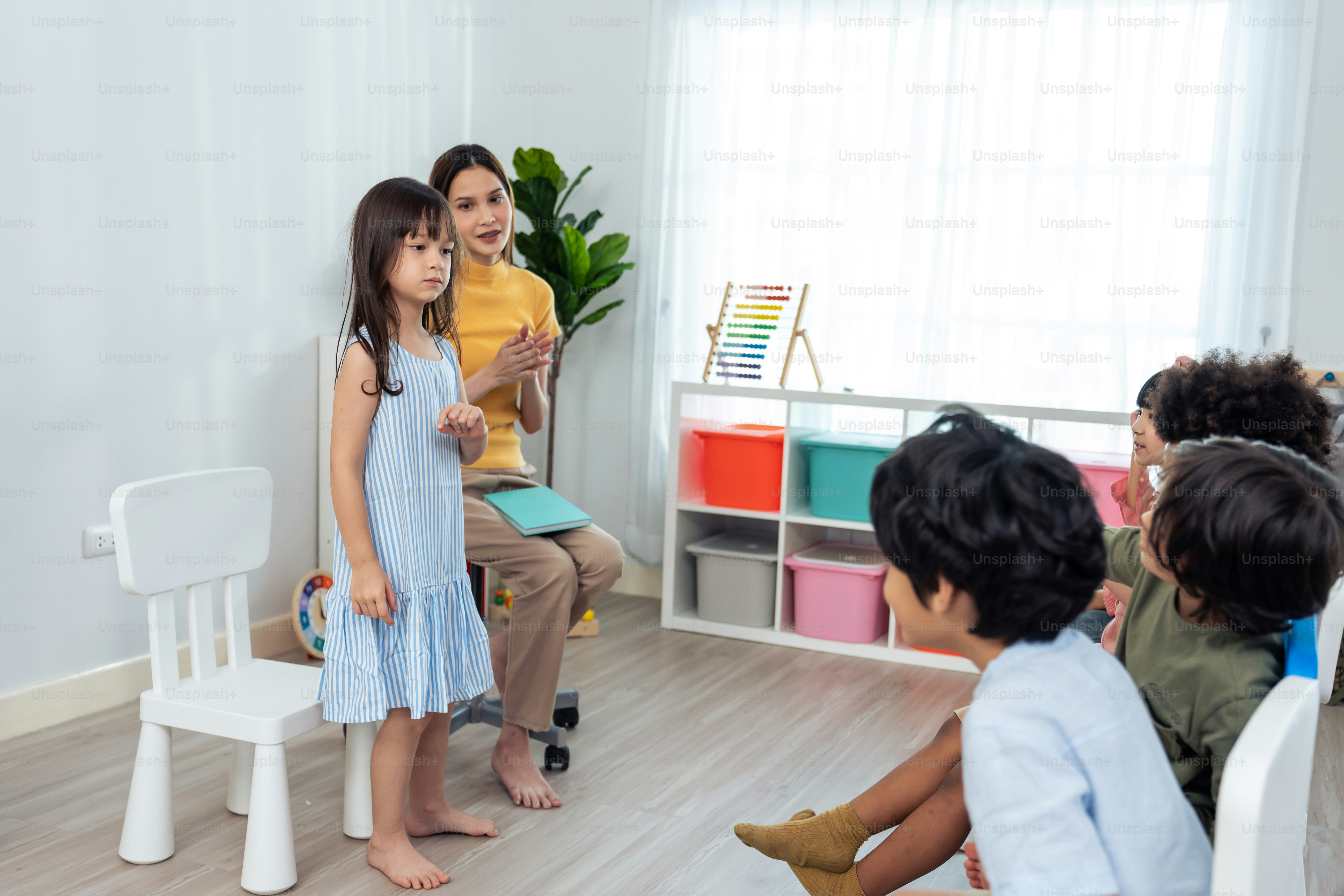 Asian beautiful young woman teacher teaching a lesson to kid at school ...