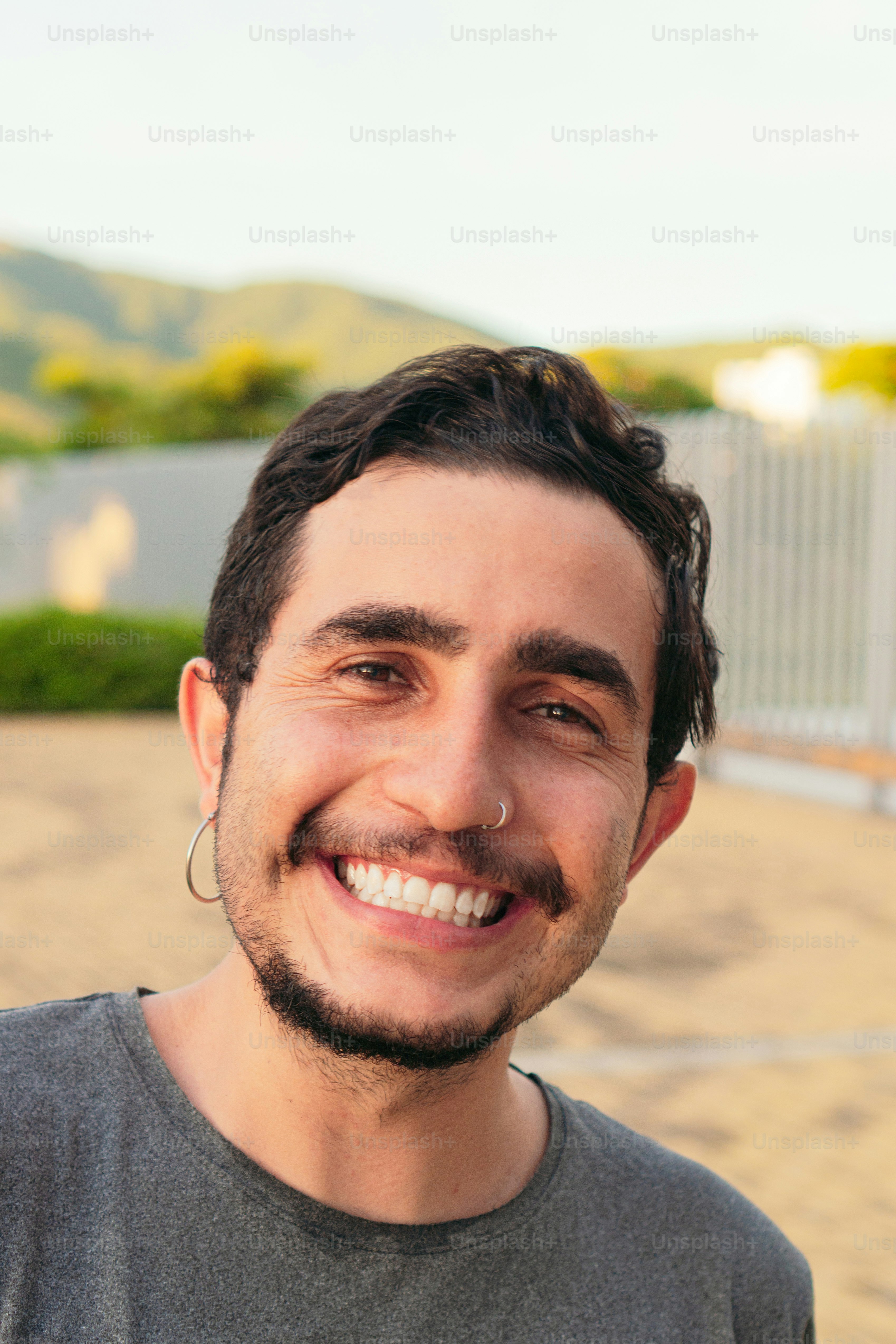 Portrait of young adult Hispanic outdoors. photo – Portrait Image on ...