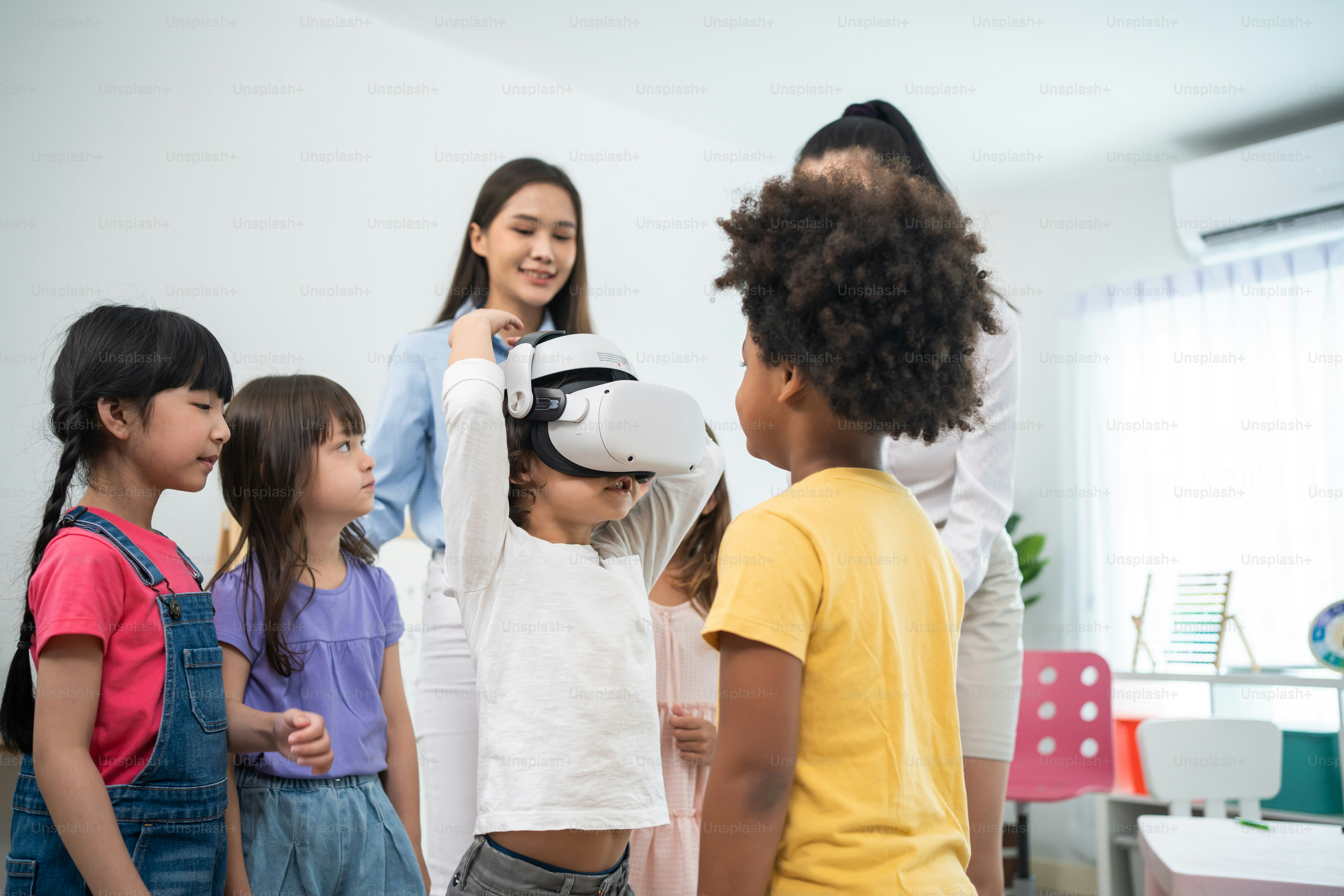 Caucasian beautiful woman teacher doing activity with kids at school. Attractive Instructor ...