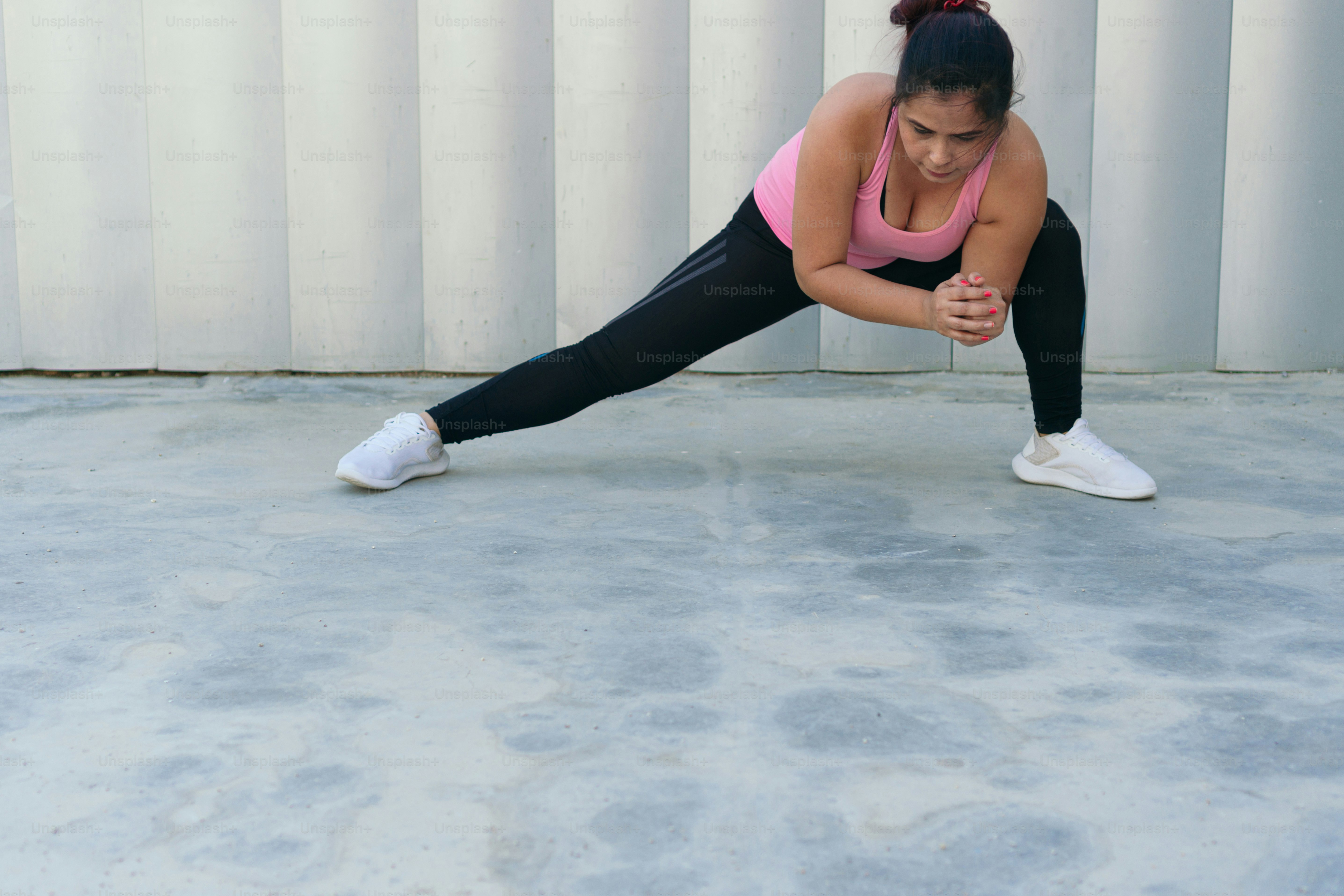 Latina athlete doing stretching exercise in park photo – Colombia Image ...
