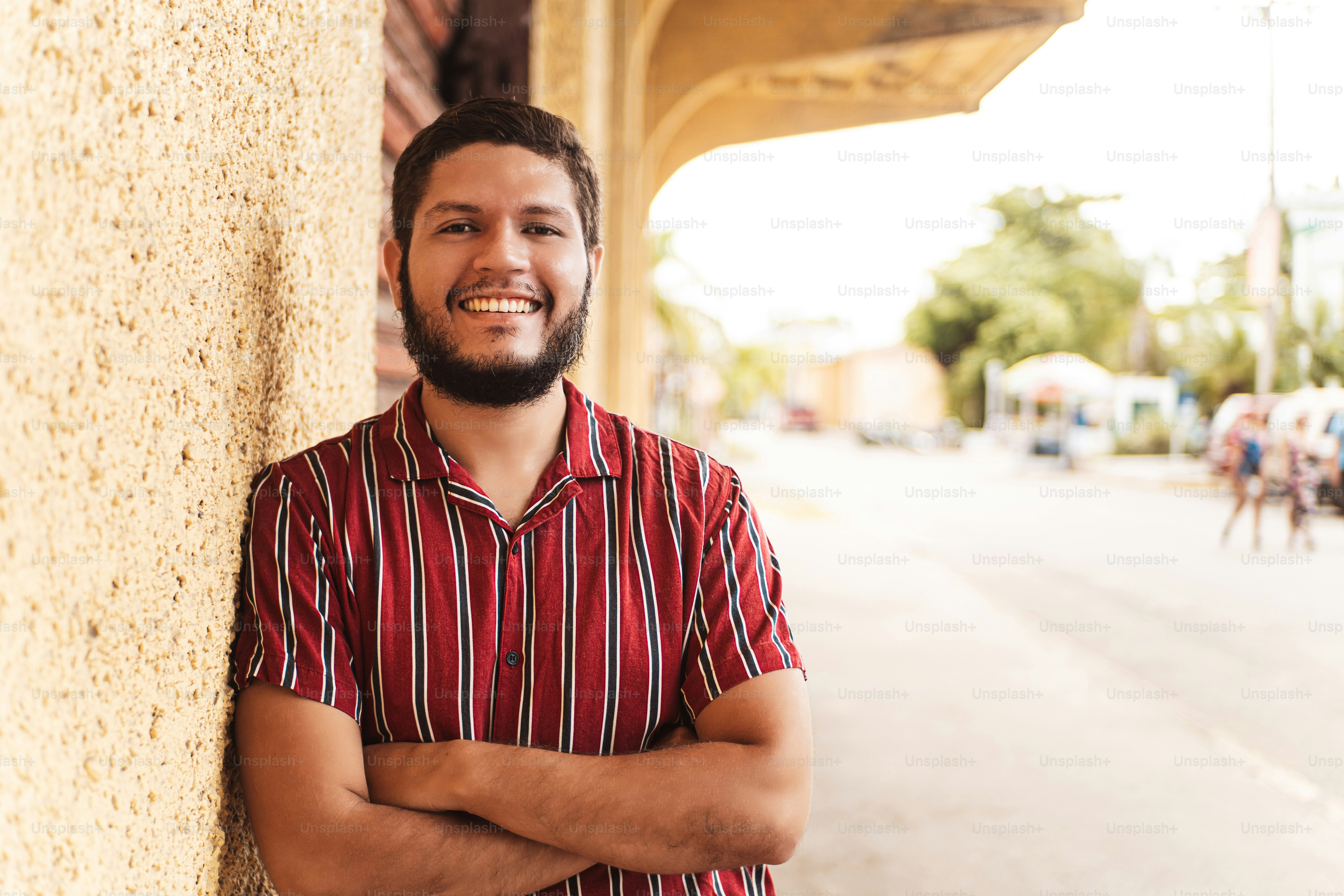 Portrait of a young latin american man smiling looking at camera. photo ...