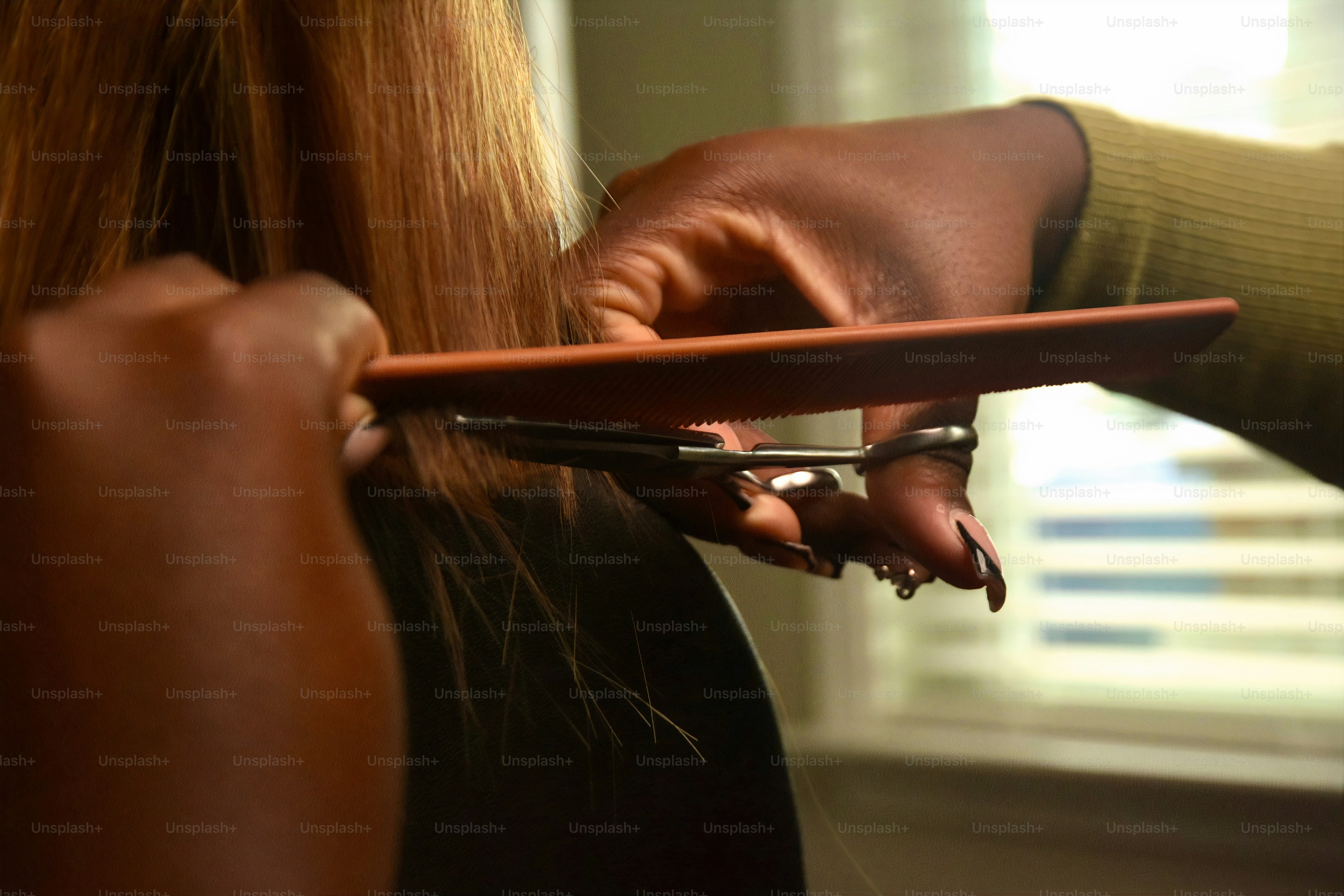 A woman cutting her hair with a pair of scissors photo – Hair cut Image ...