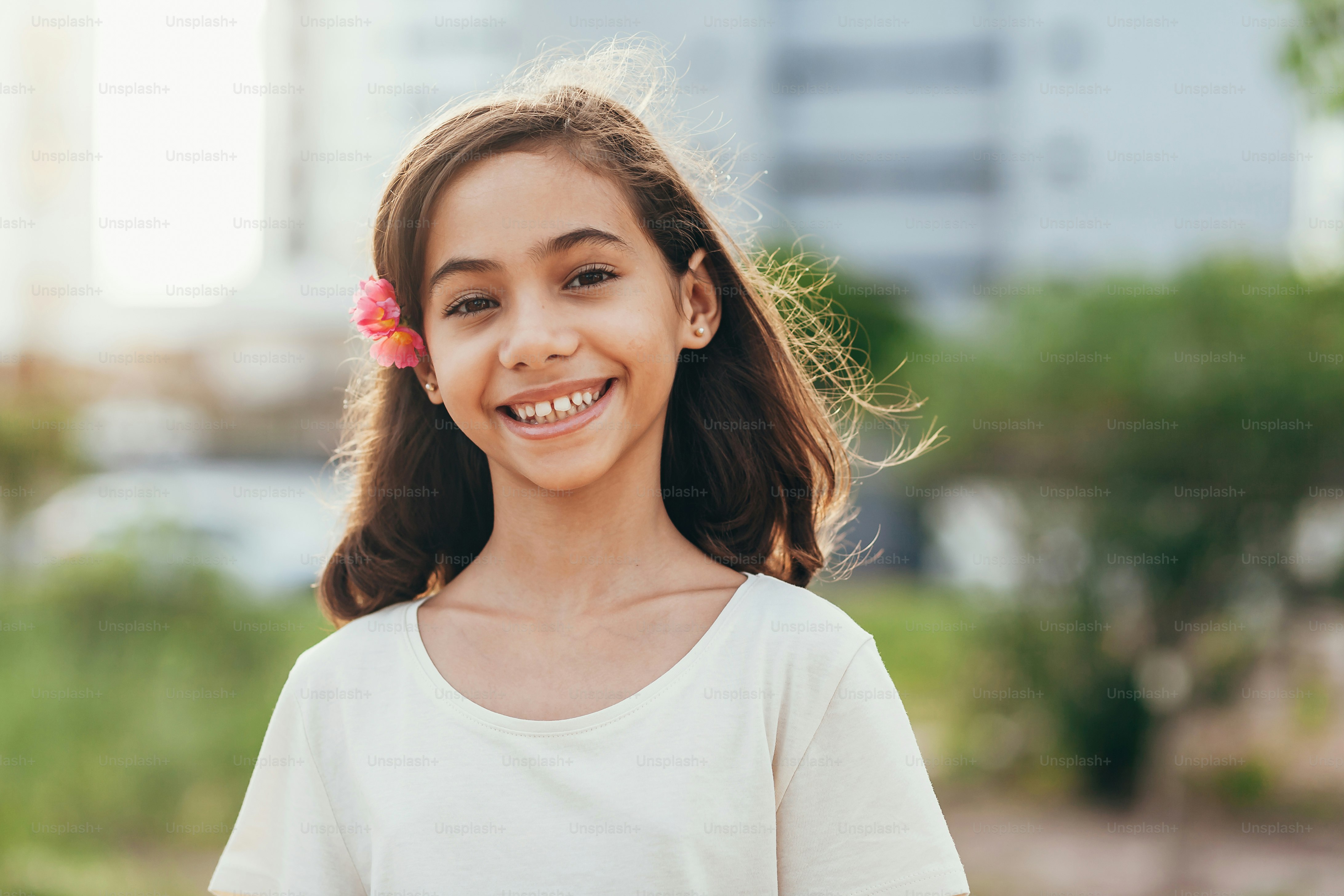 Cute little girl with a flower in her hair photo – Brazilian woman ...