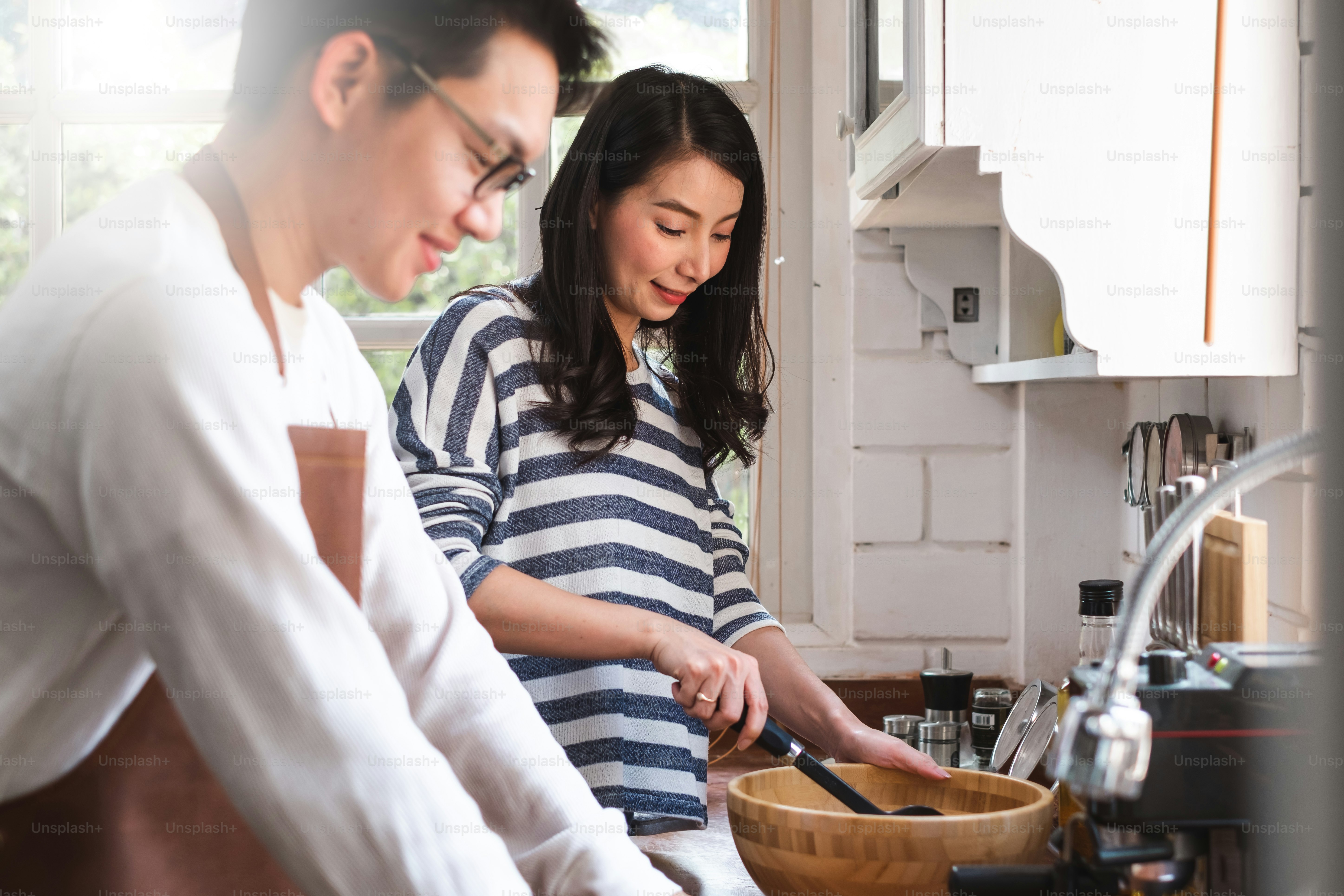 Asian couple family cooking food together in kitchen, happy family ...