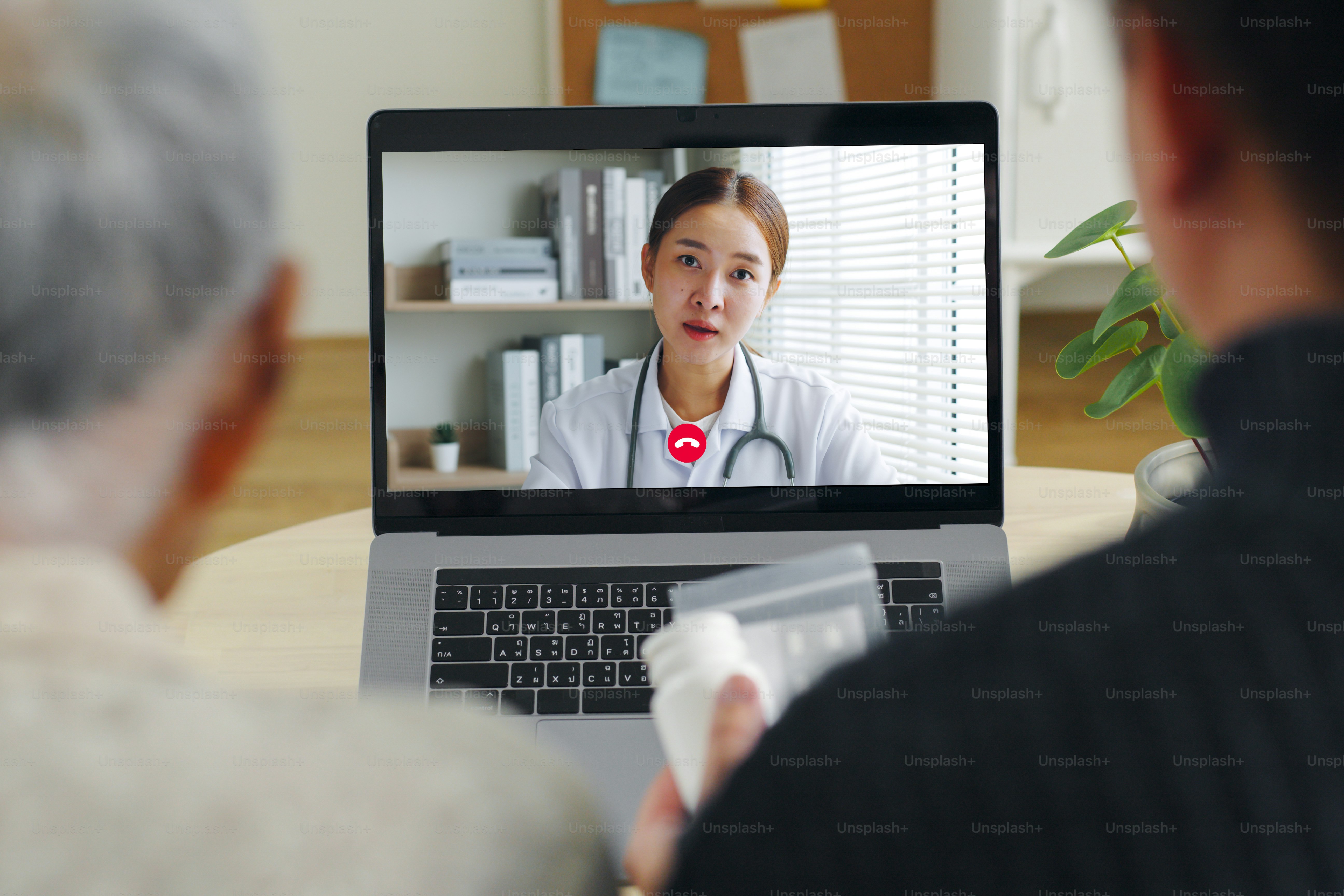 Asian senior woman grey hair 80-90s video call with doctor ...