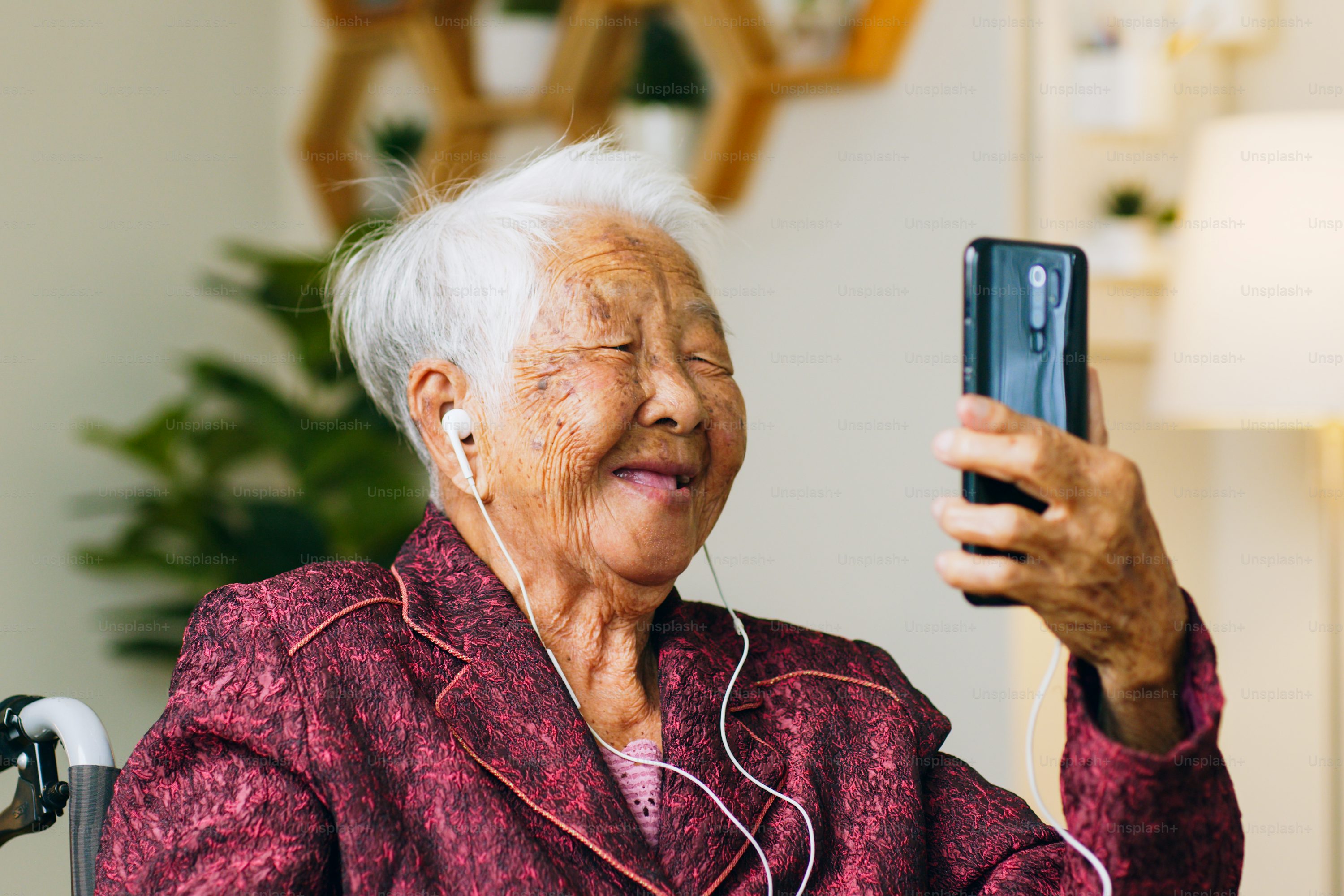 Asian old senior making video call via mobile phone talking with family ... Asian old senior making video call via mobile phone talking with family ...