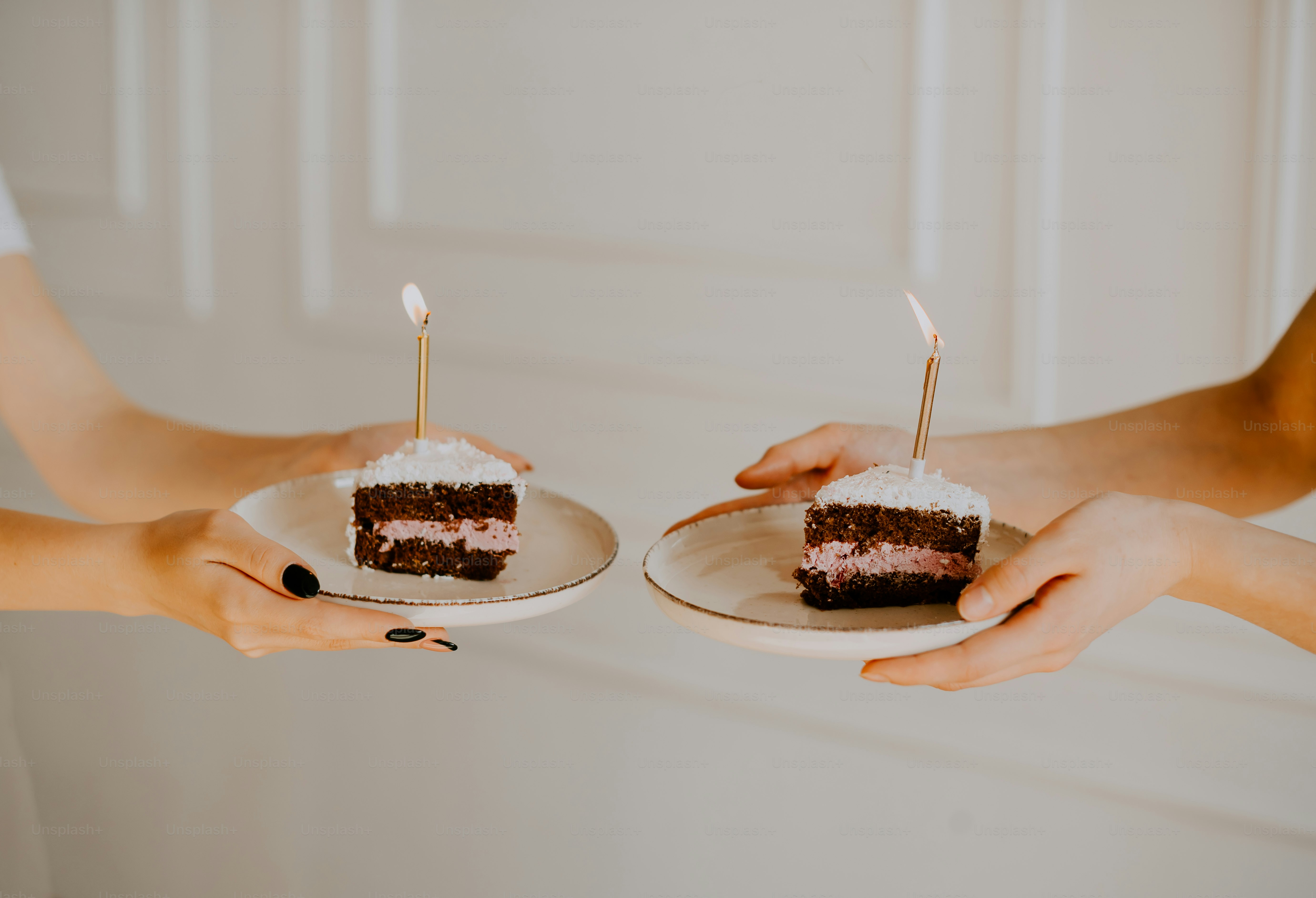 Two people holding plates with two slices of cake photo – Layer cake ...