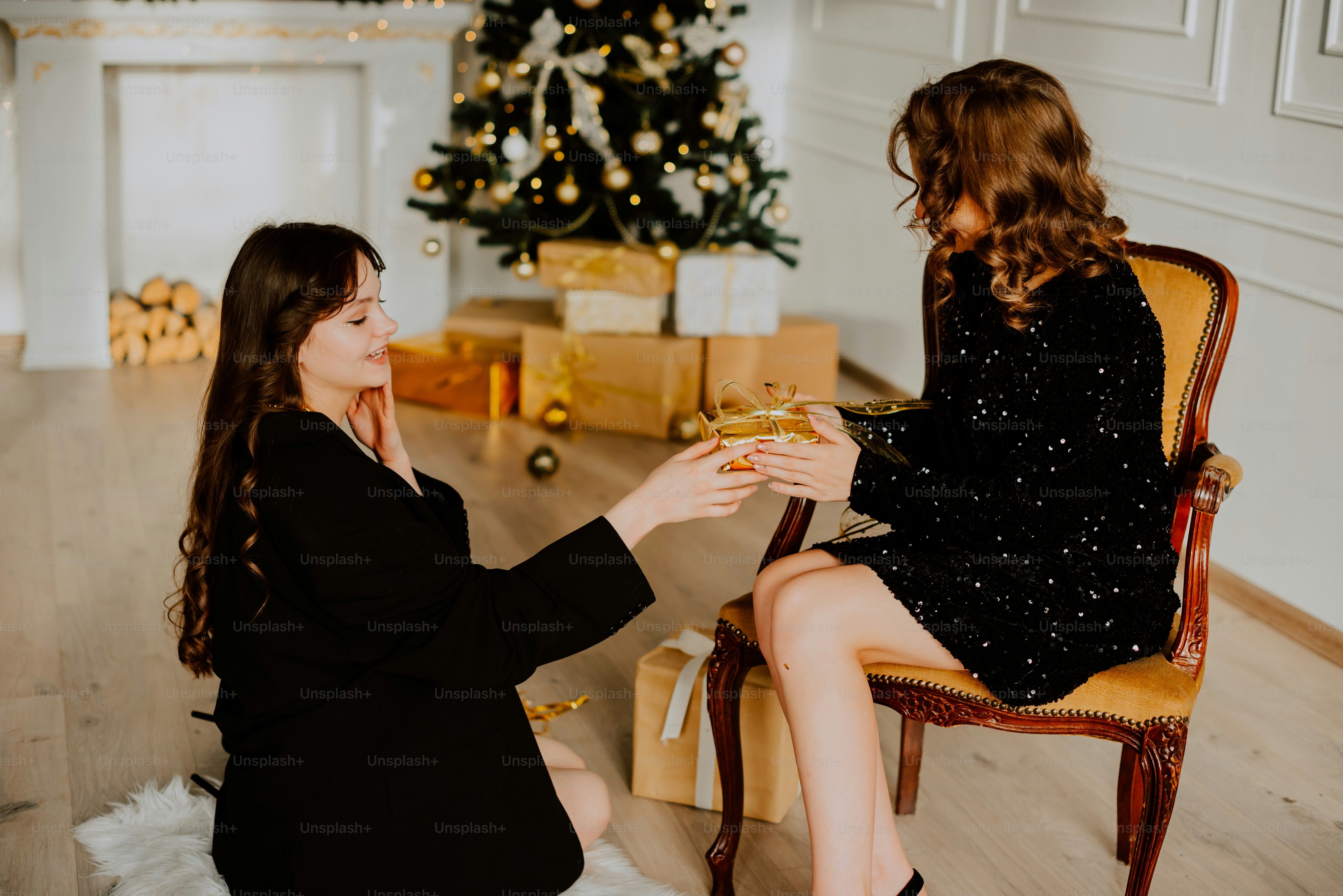 A woman sitting on a chair holding a slice of pizza photo – Gift ...