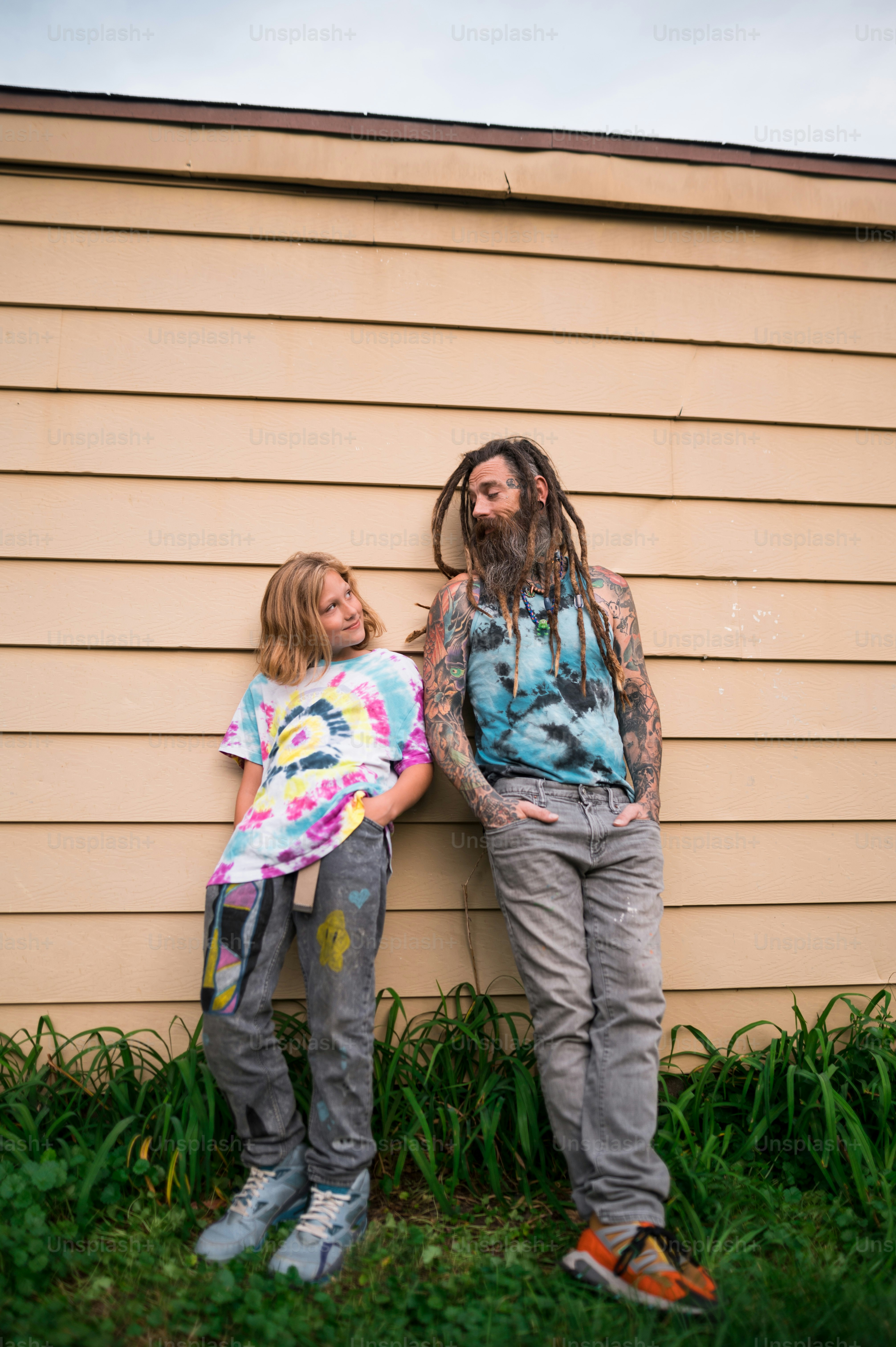 A man with dreadlocks standing next to a little girl photo – Father ...