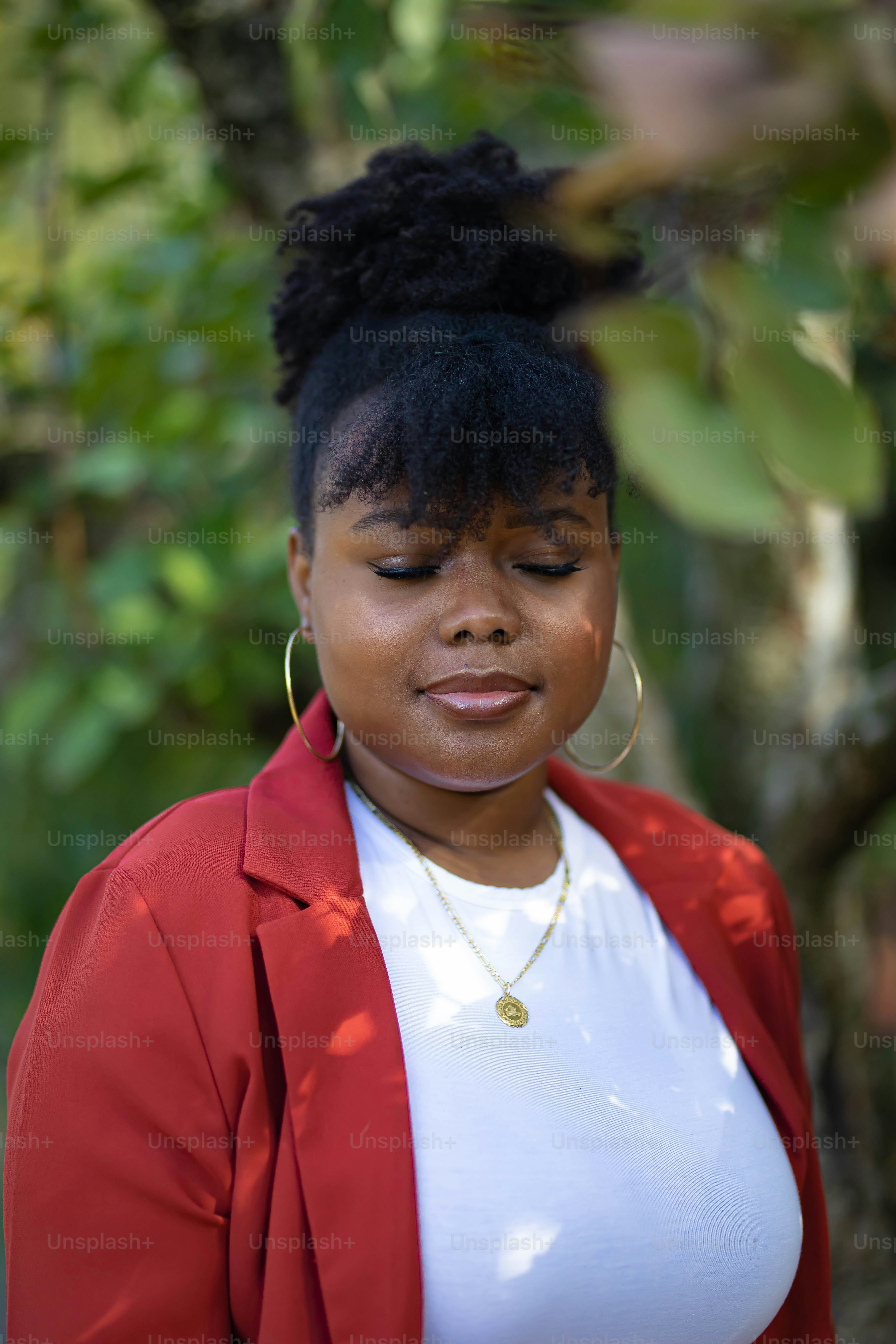 A woman wearing a red jacket and white shirt photo – Female Image on ...