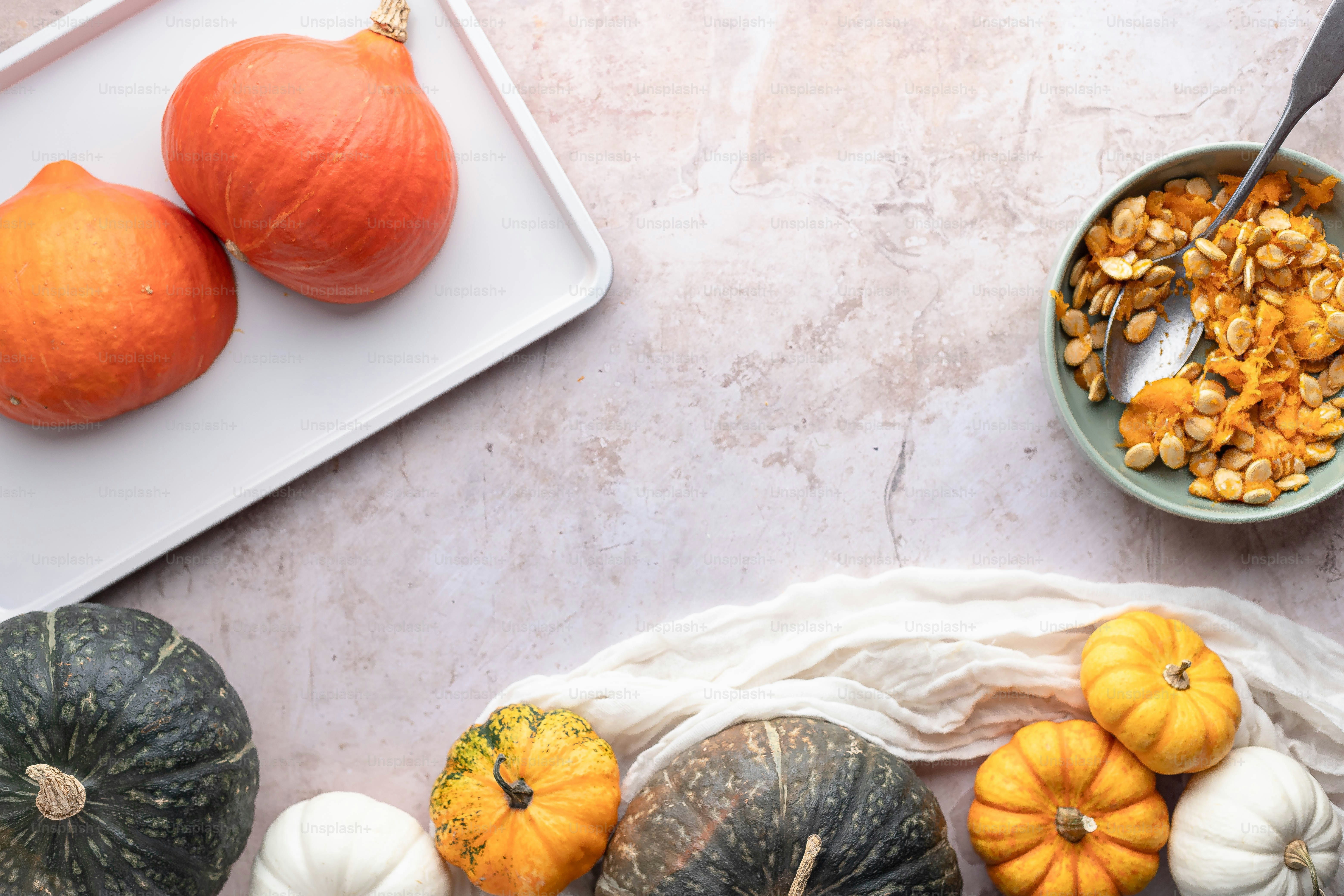 A table topped with lots of different types of pumpkins photo ...