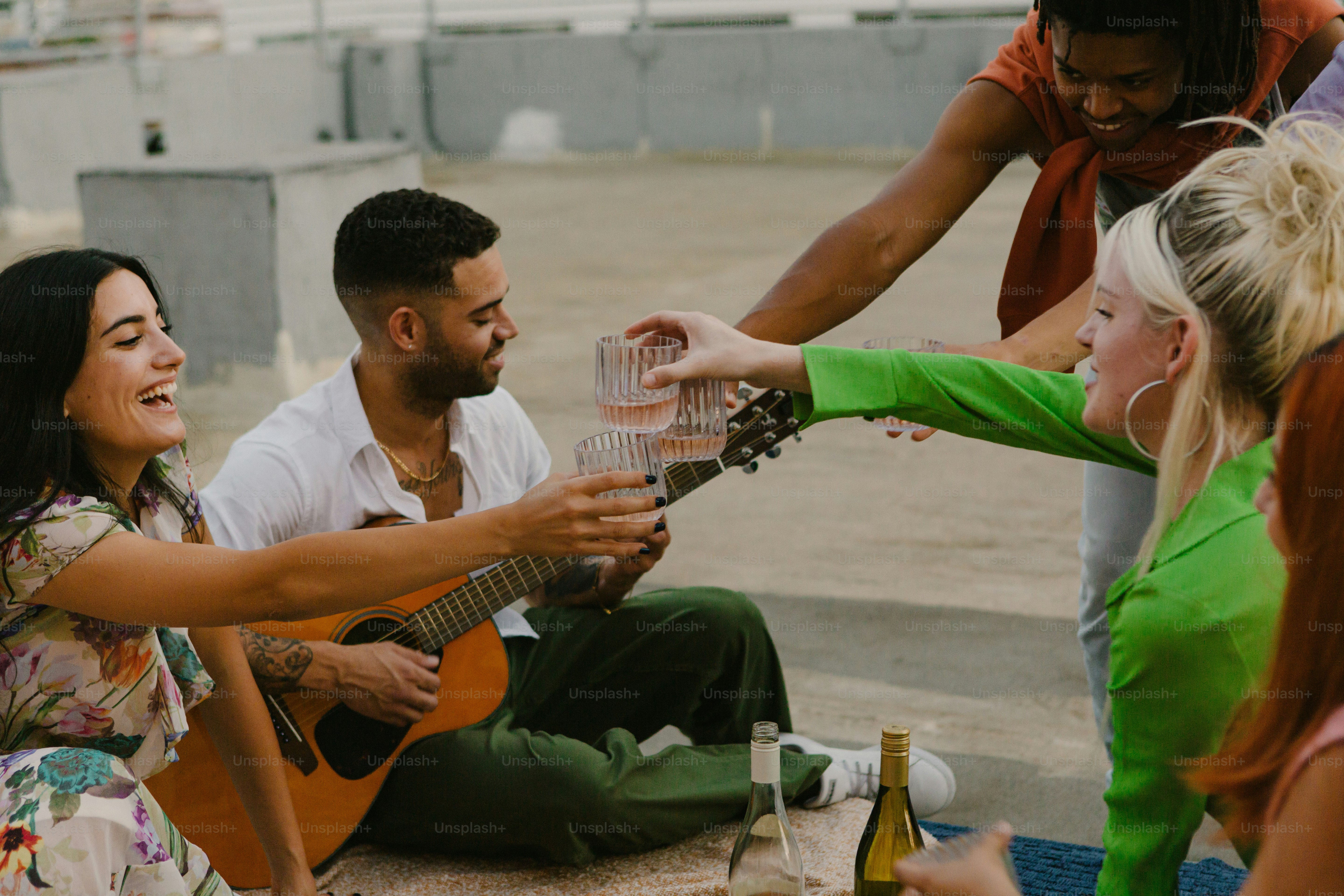 A group of people sitting around each other photo – Talent Image on ...