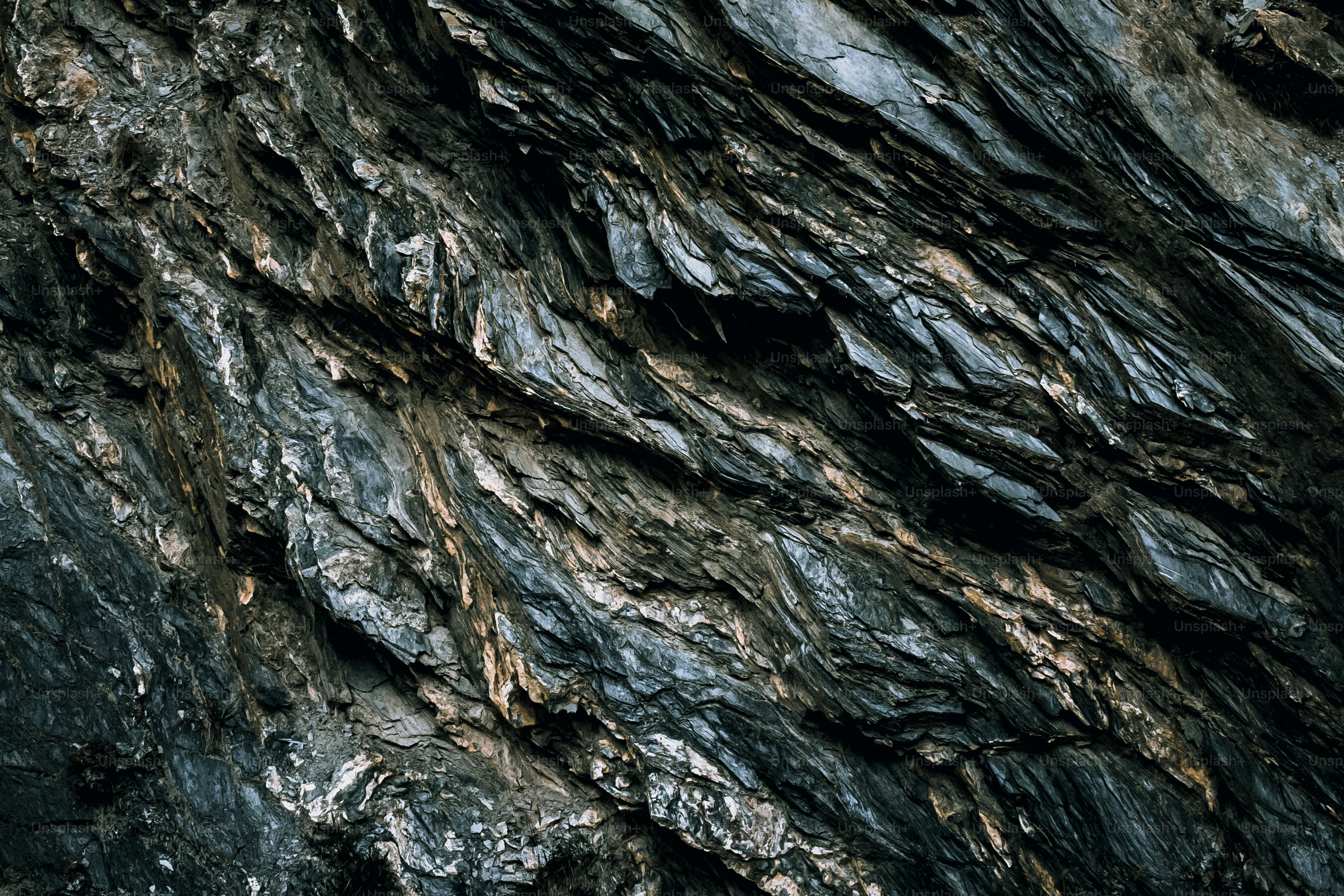 A close up view of a rock face photo – Wallpapers Image on Unsplash