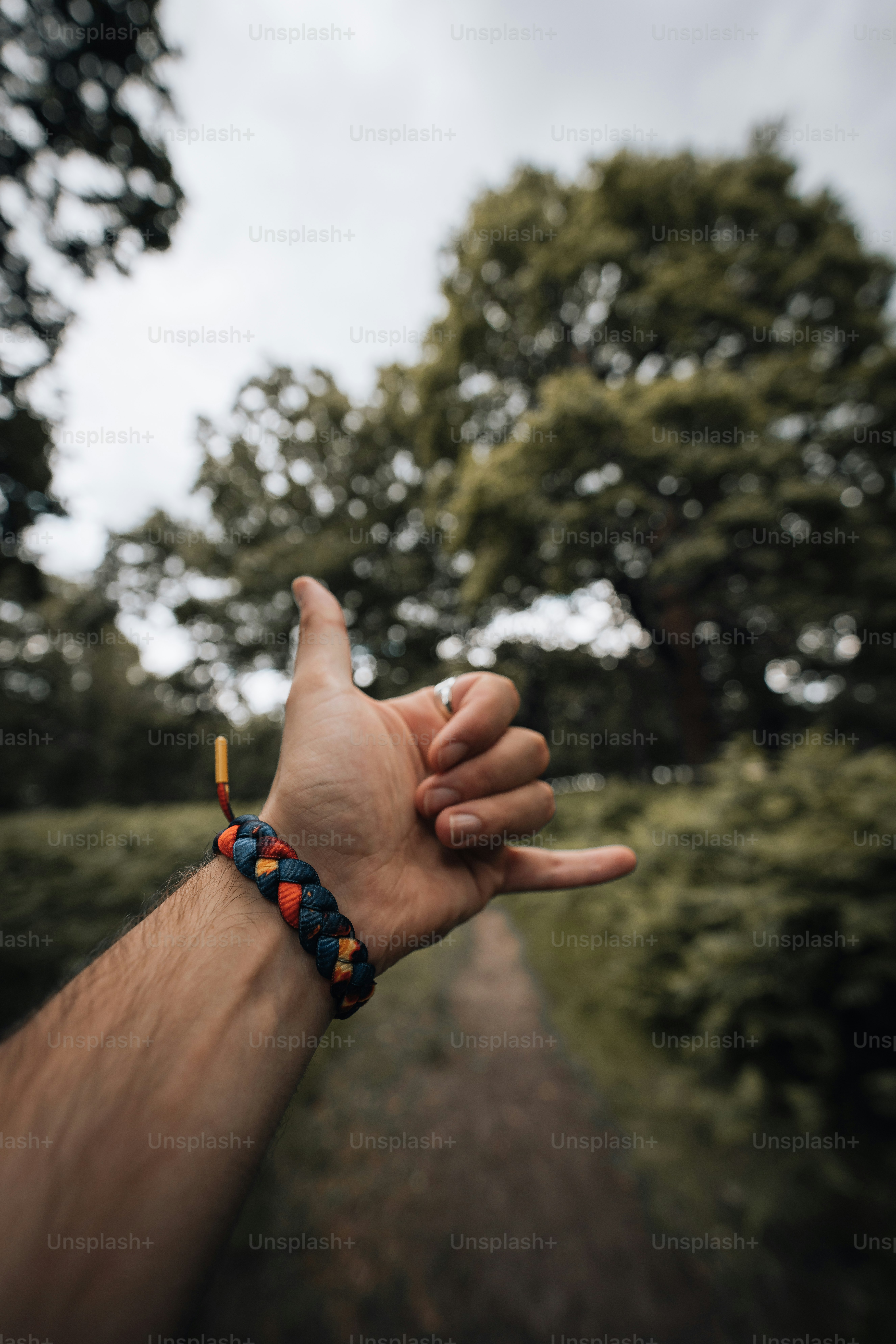 A person is holding their hand out in the air photo – London uk Image ...
