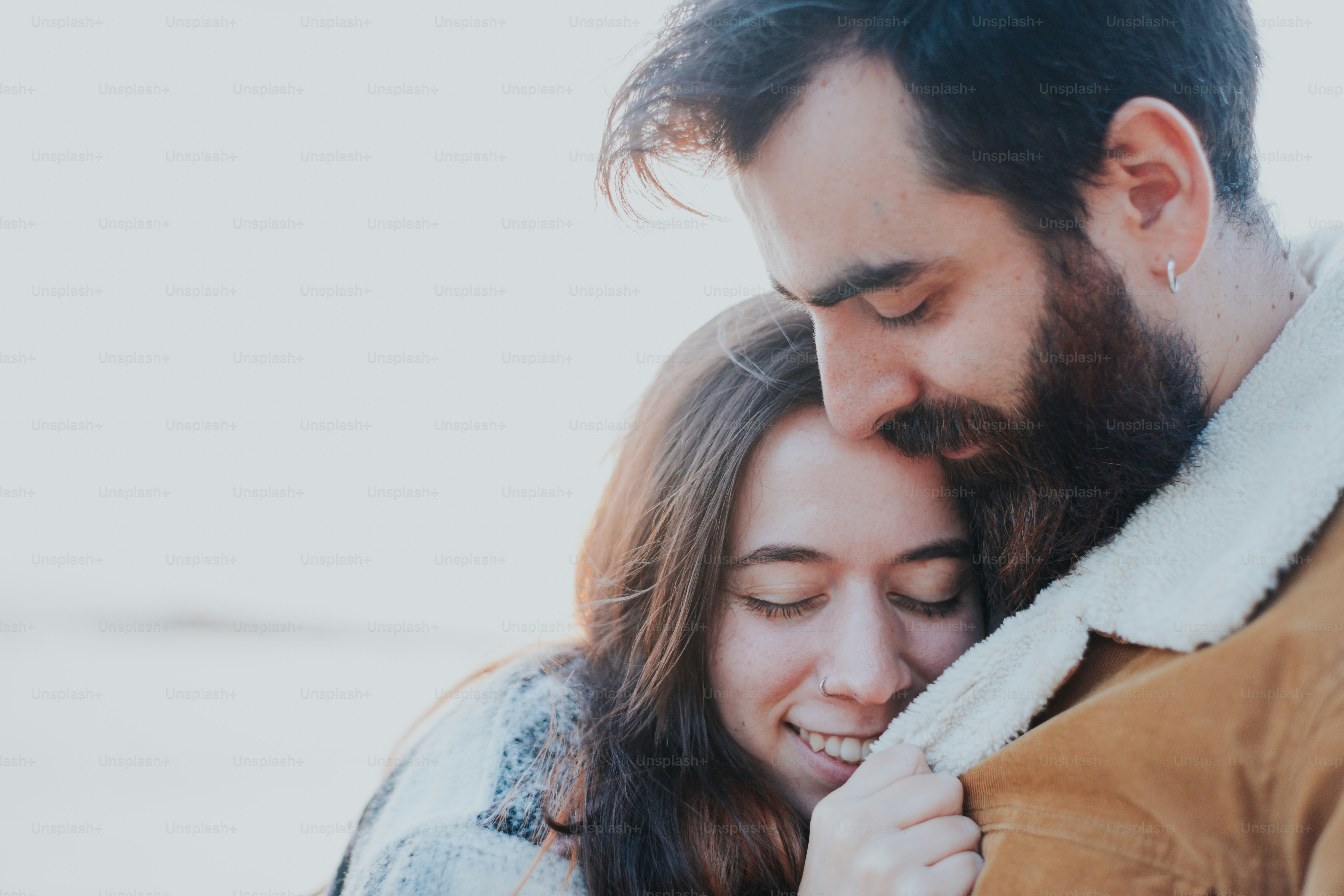 A man and a woman embracing each other photo – Couple hug Image on Unsplash