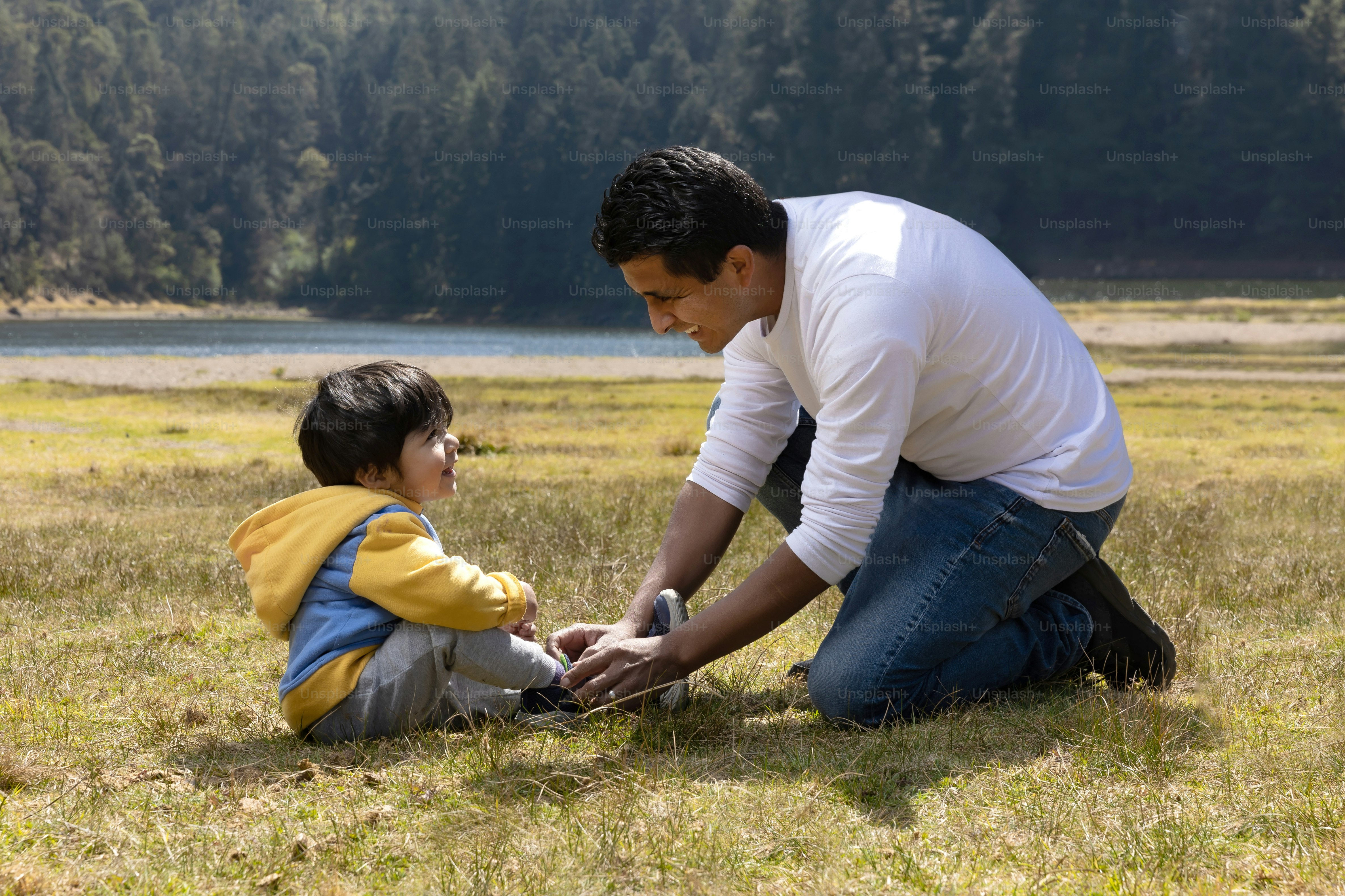 Mexican father and son having fun outdoors photo – Bonding Image on ...