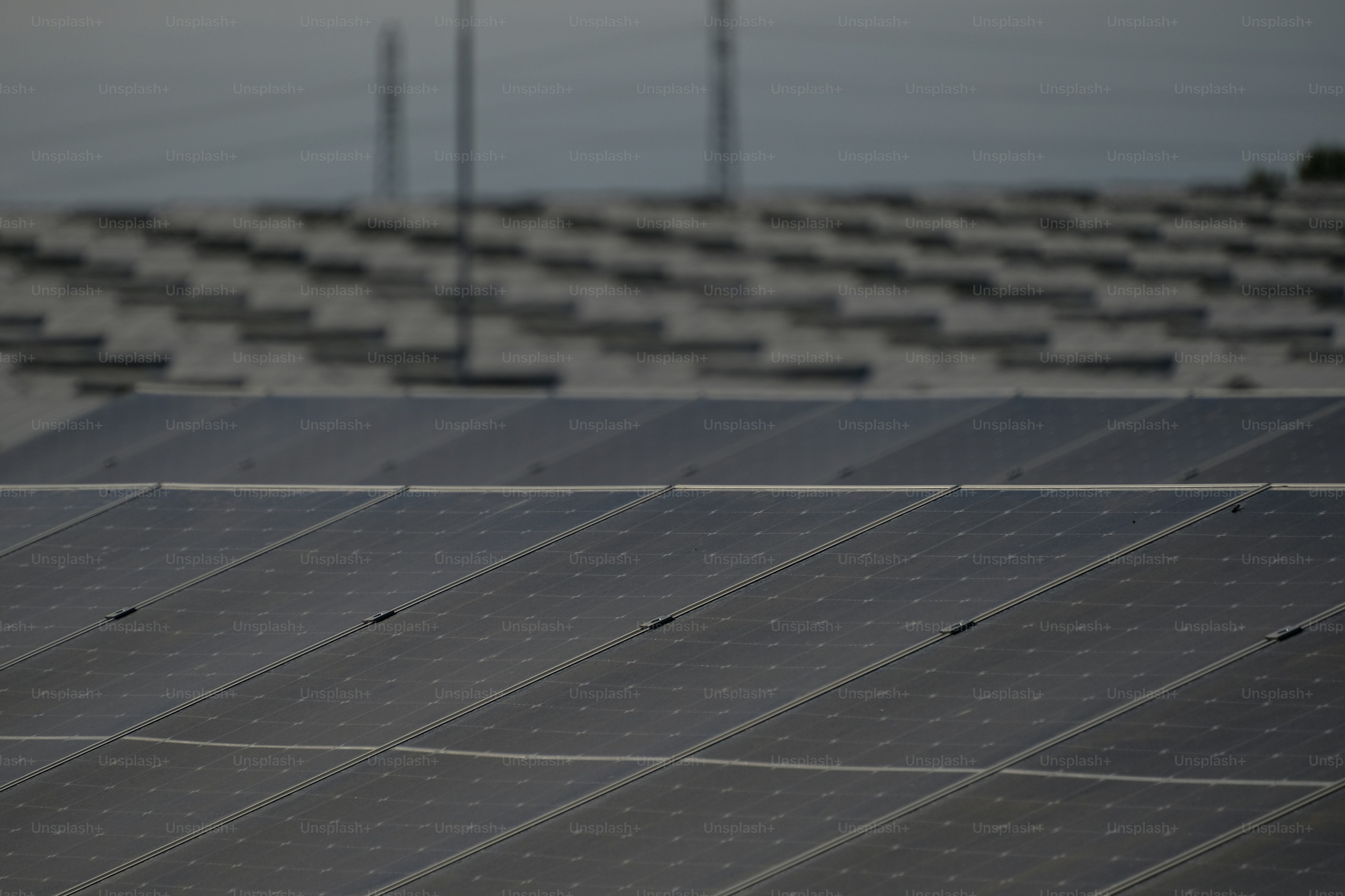 A row of rows of solar panels on a roof photo – Sustainable energy ...