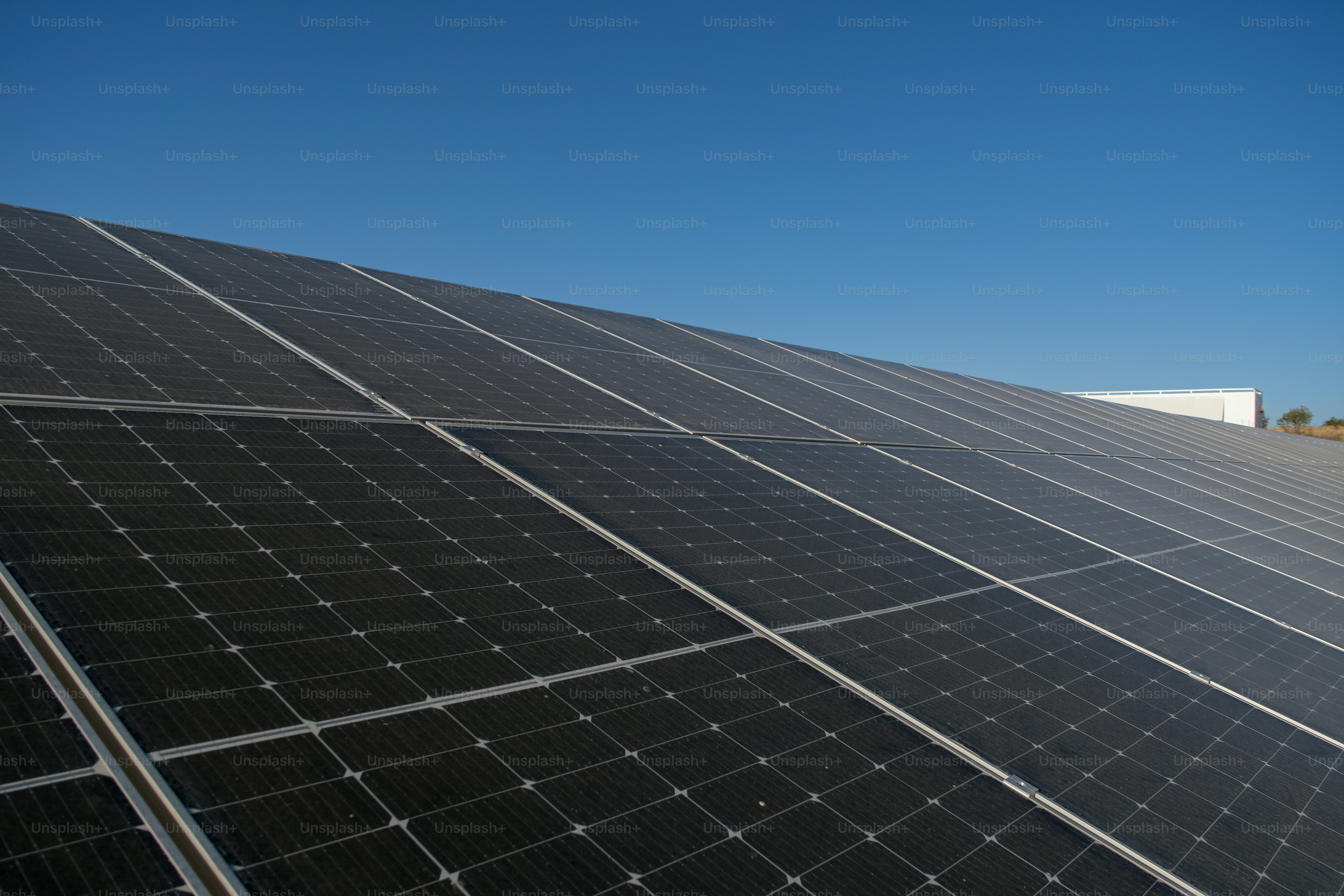 A solar panel on the roof of a building photo – Solar energy Image on ...