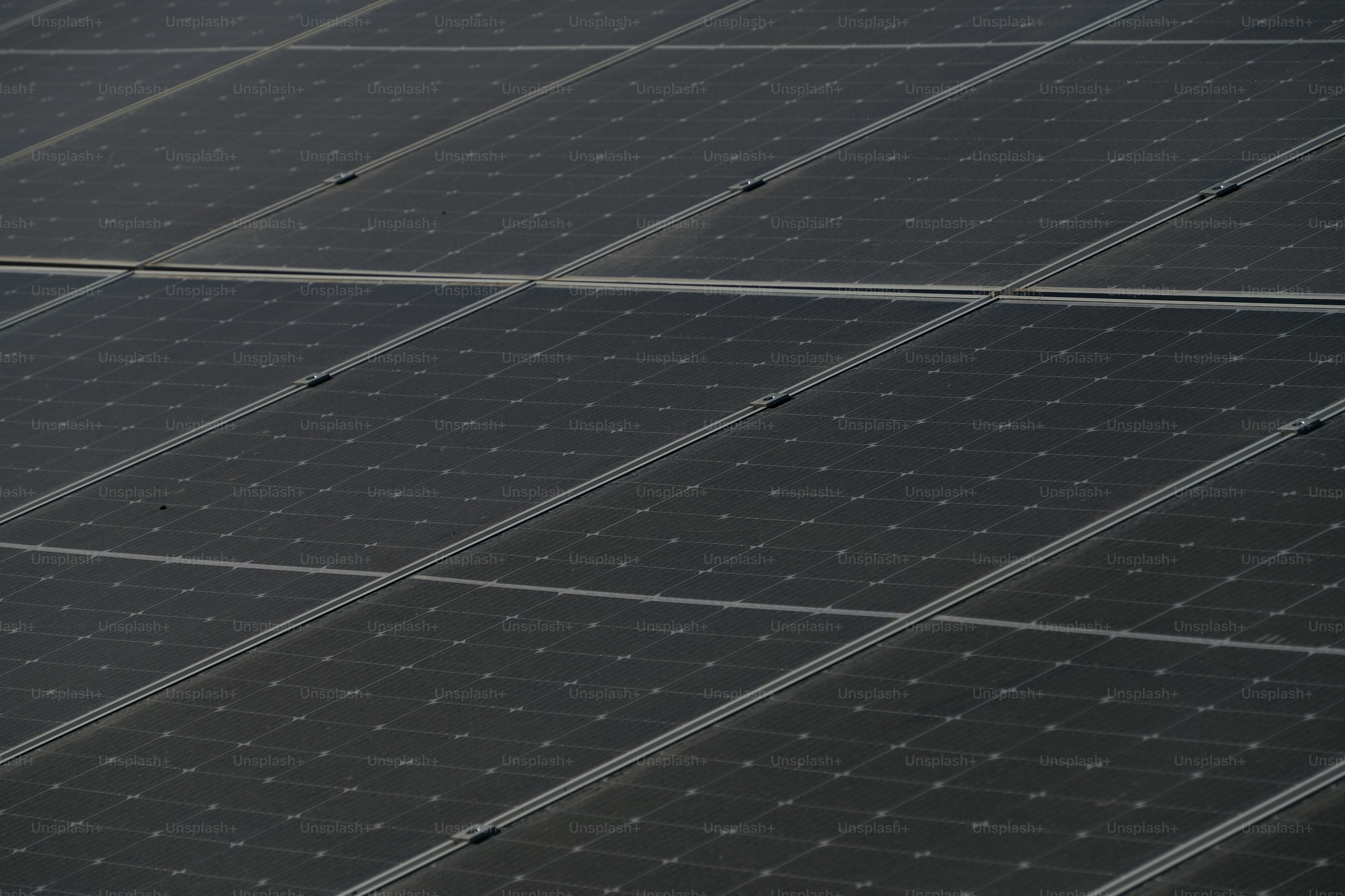 A large solar array in the middle of a field photo – Solar panel Image ...