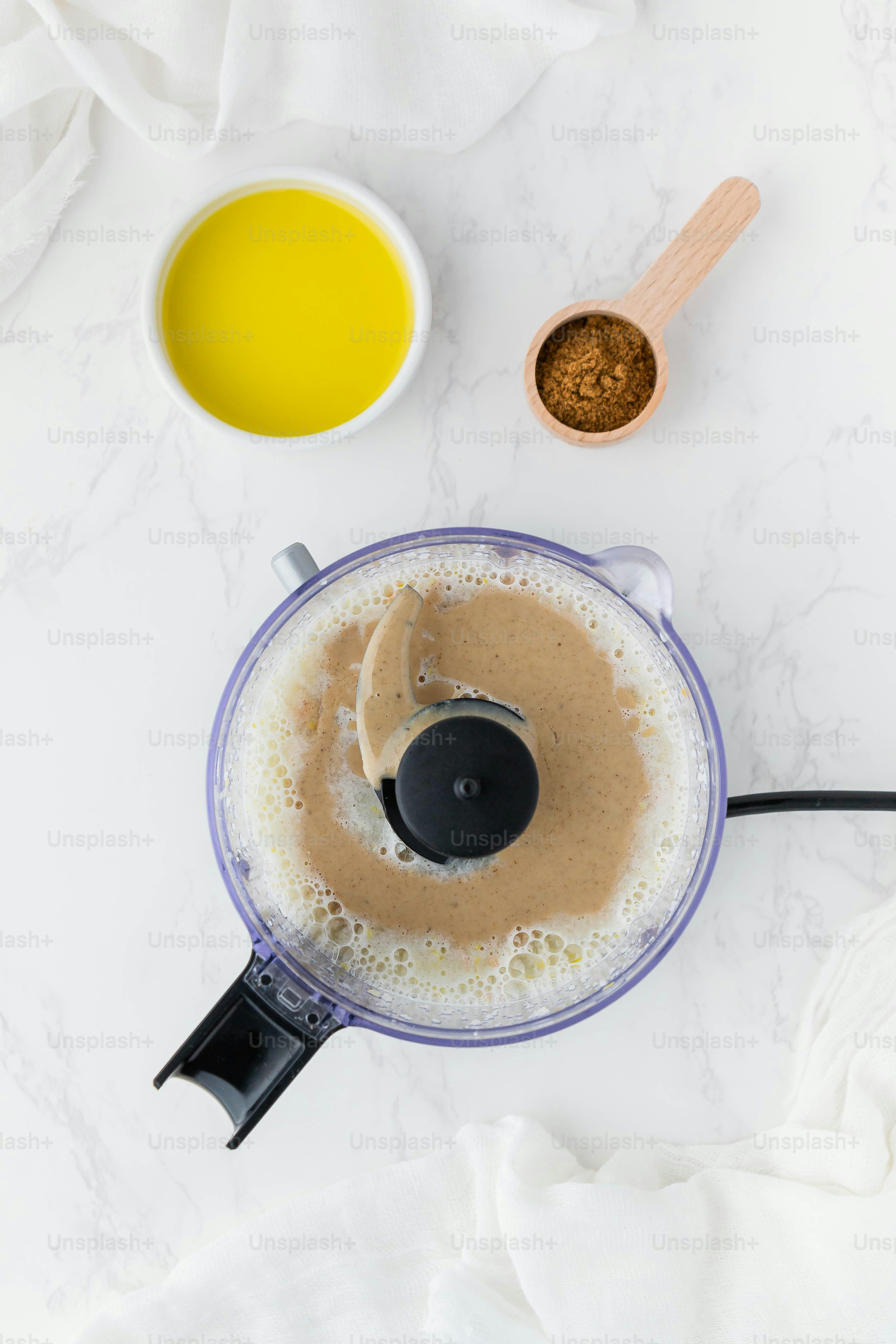 A blender filled with a mixture of liquid and spices photo – Food Image ...